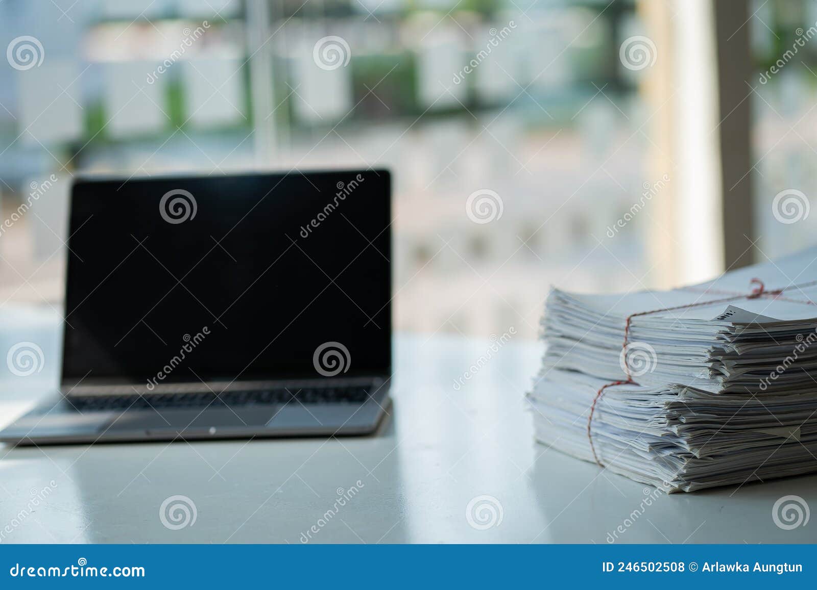 Paper Documents Stacked on a Wooden Table at Work. Business Idea Laptop ...