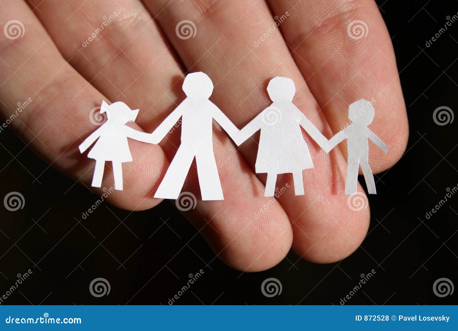 Paper family on hand stock photo. Image of partnership - 872528