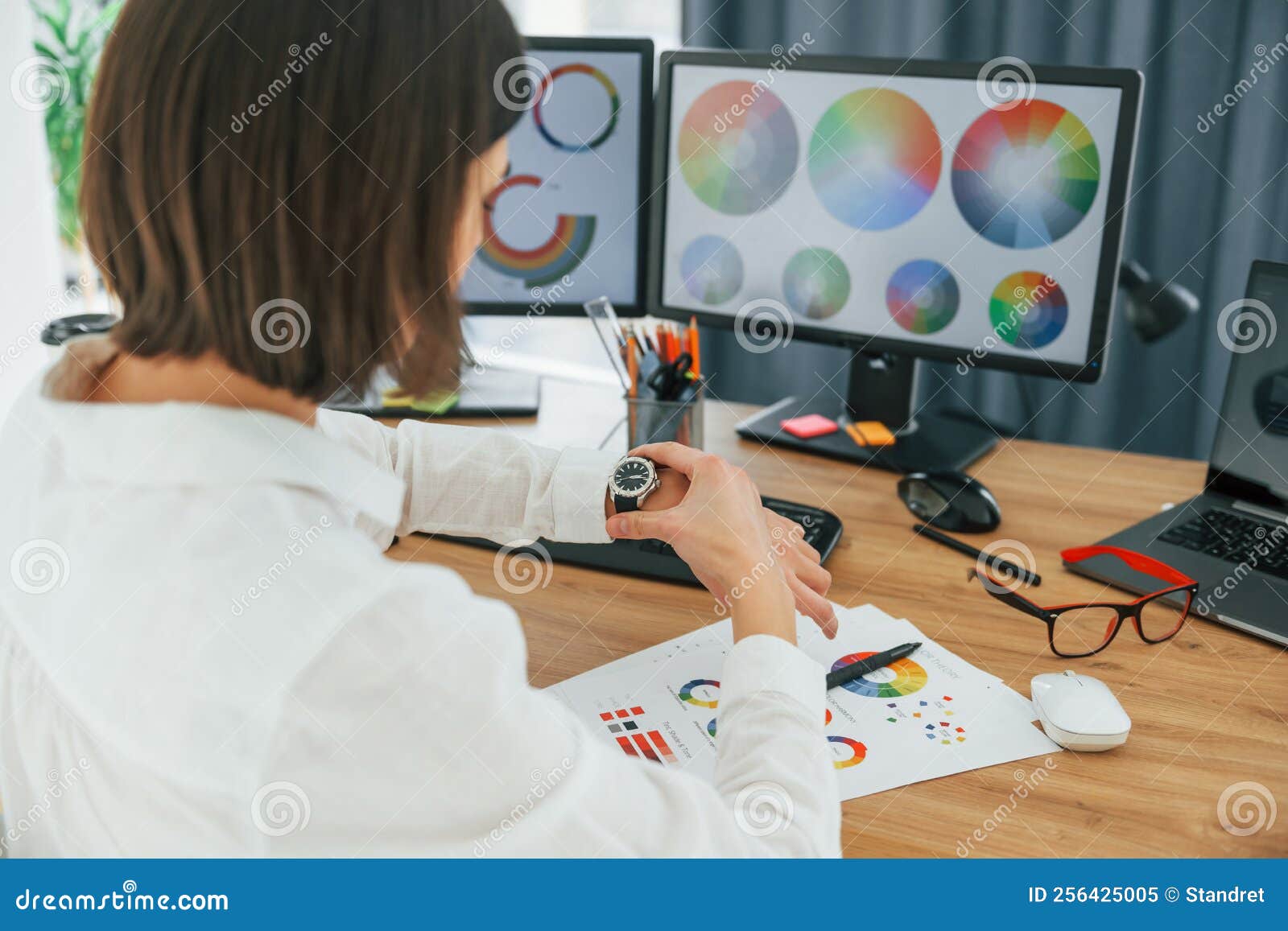 With Paper. Female Designer Working in the Office by Using PC Stock ...