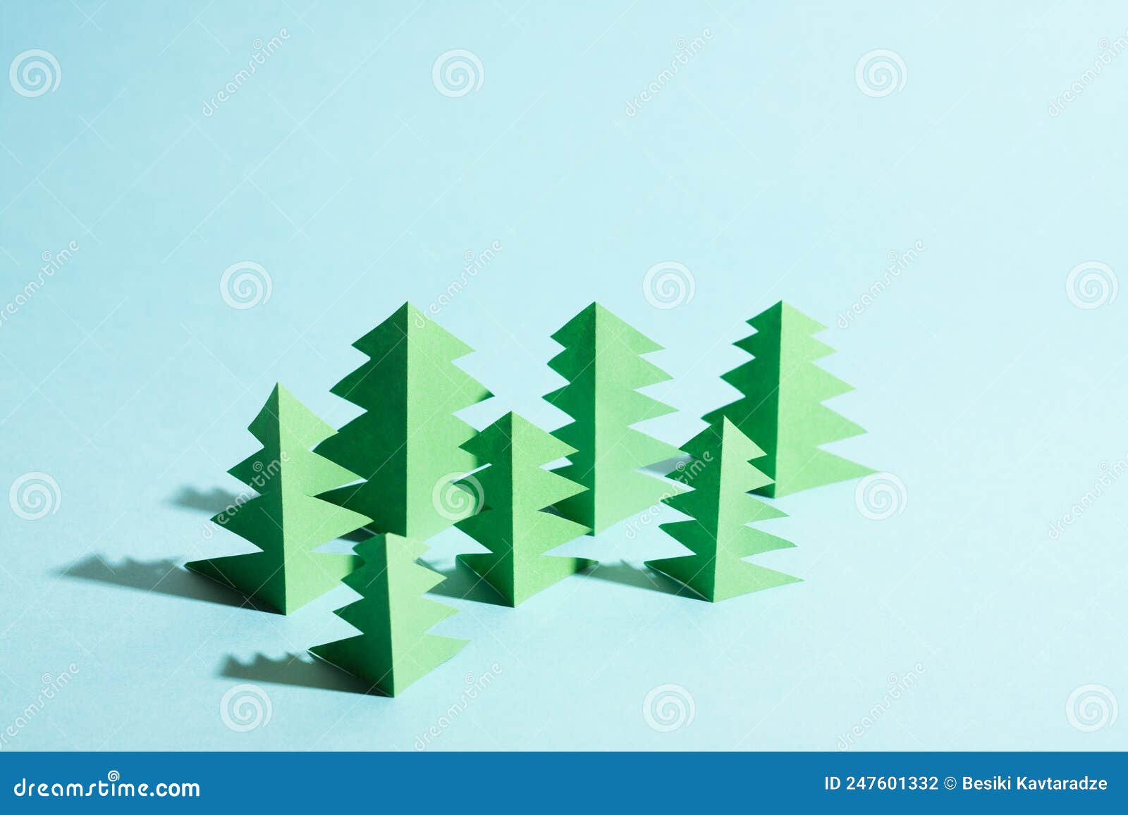 Green Paper Trees on Blue Background Stock Photo - Image of handcrafted ...