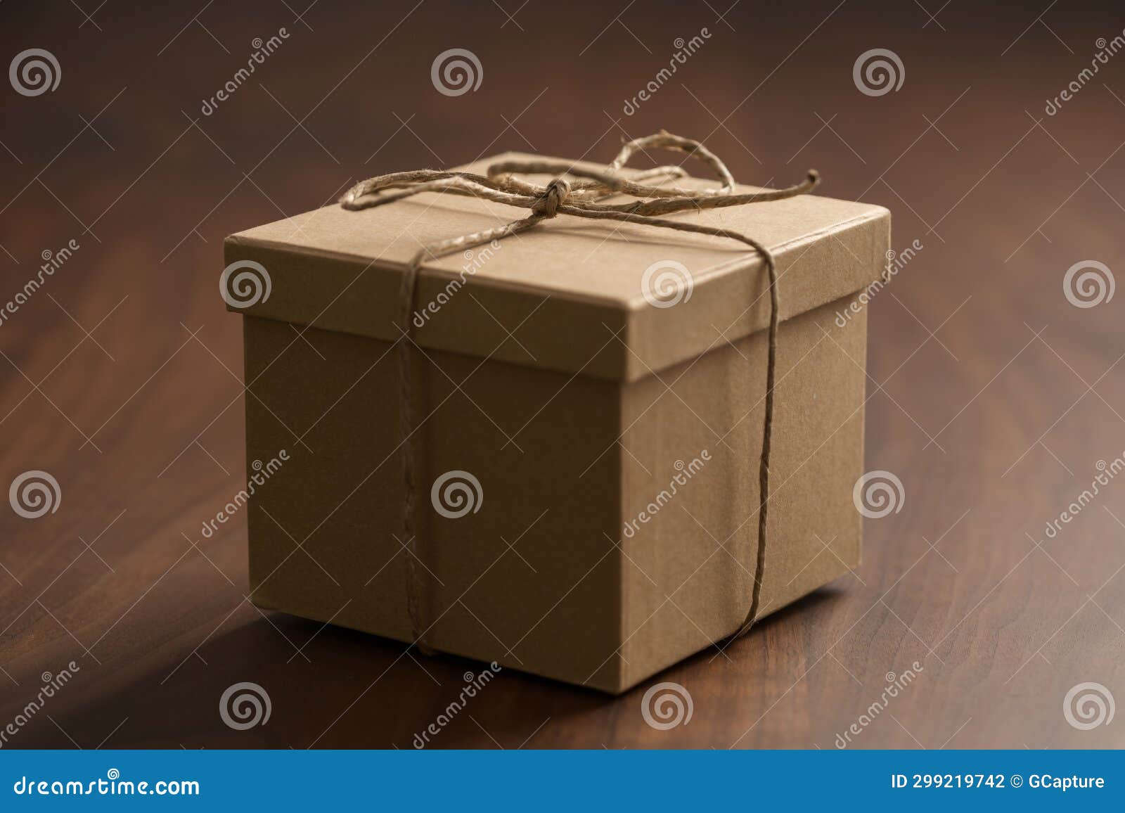 Paper Gift Box with Rope on Walnut Wood Table with Copy Space Stock ...