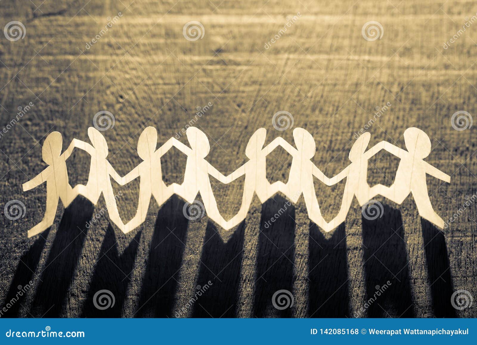 Paper Human Figure Standing In Front Of Paper People Holding Hands On ...