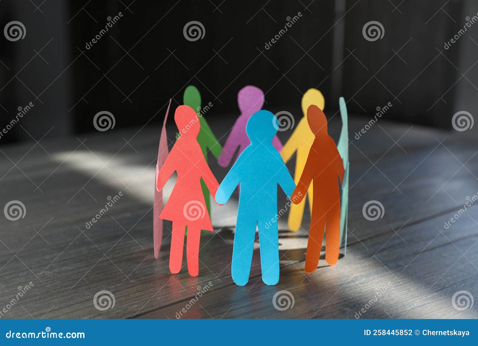 Paper Human Figures Making Circle on Wooden Table. Diversity and ...