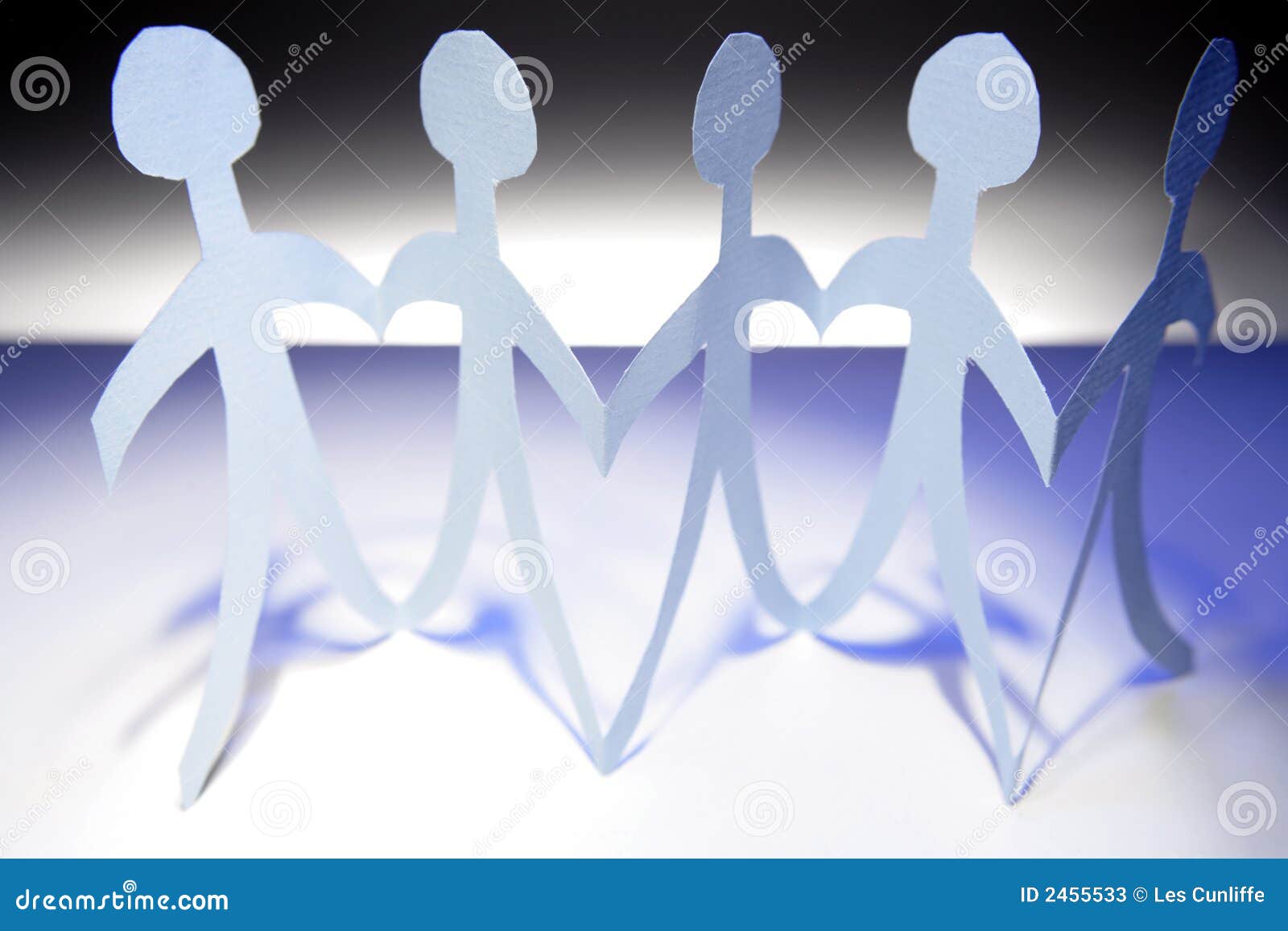 Paper men joined together stock image. Image of joining - 2455533