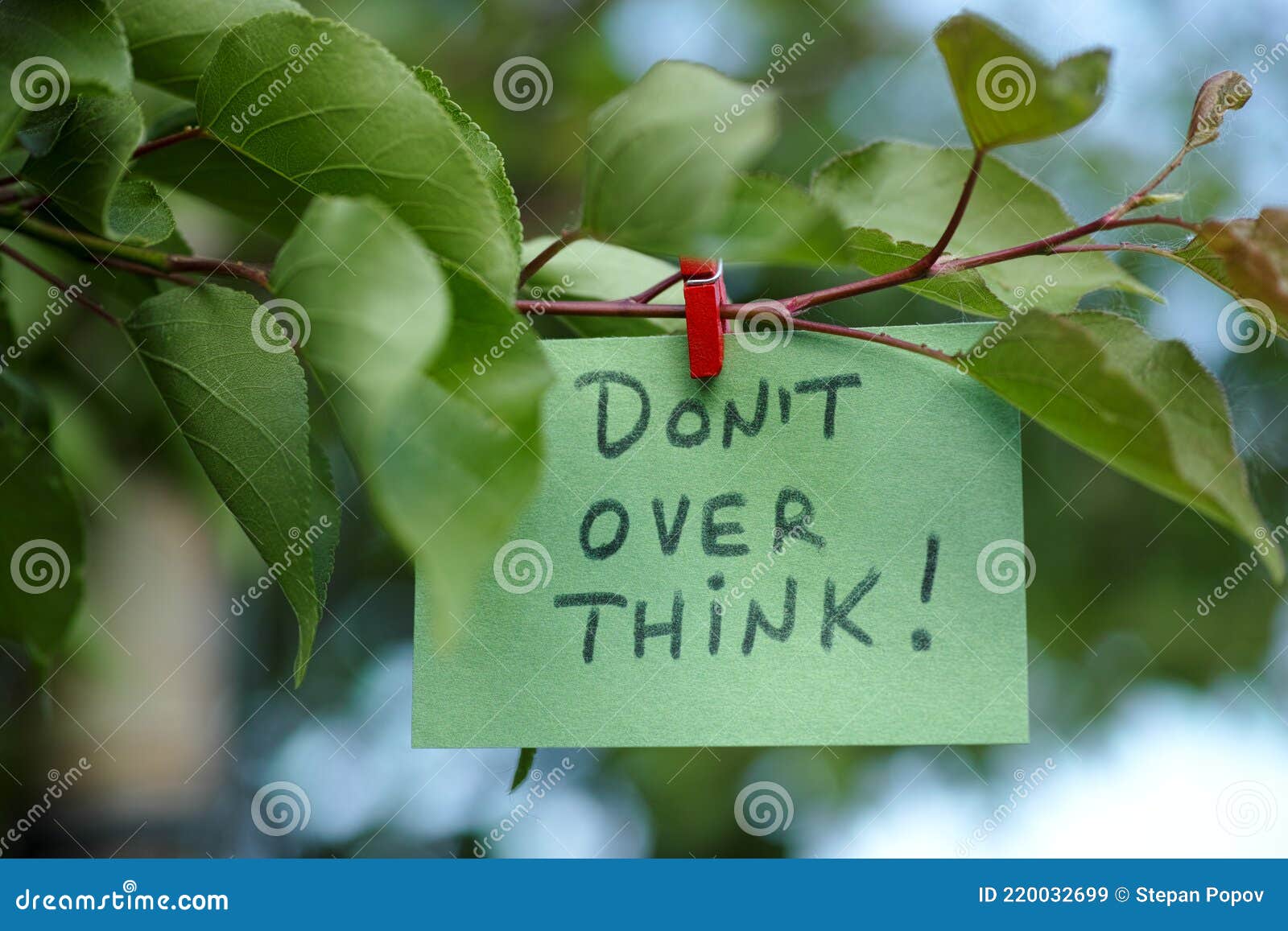 A Paper Note with the Phrase Don`t Over Think Written on it Hanging on ...