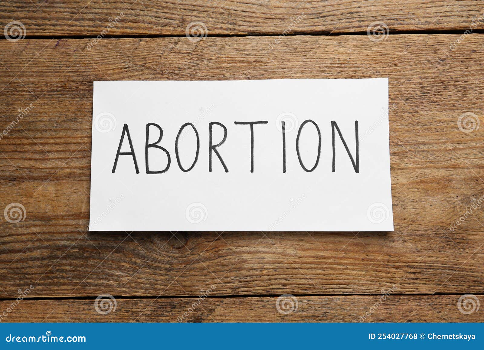 Paper Note with Word Abortion on Wooden Background, Top View Stock ...