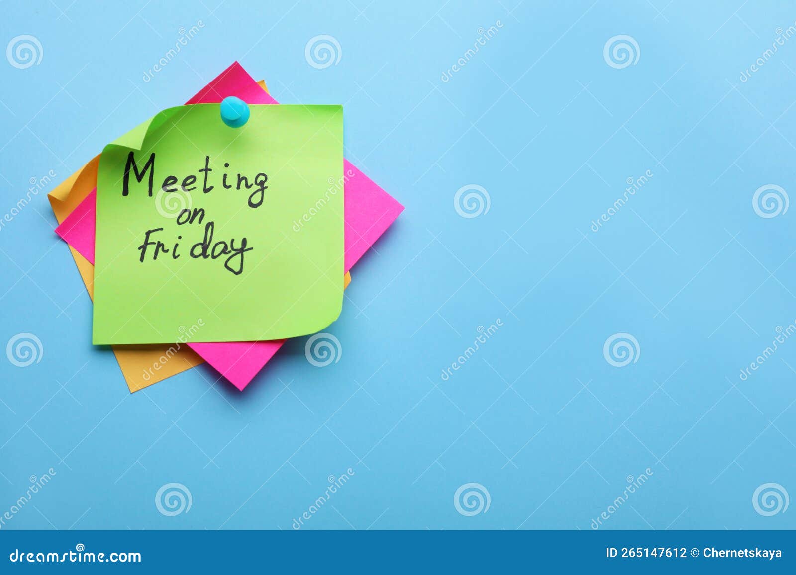 Paper Note with Words Meeting on Friday Pinned Against Light Blue ...