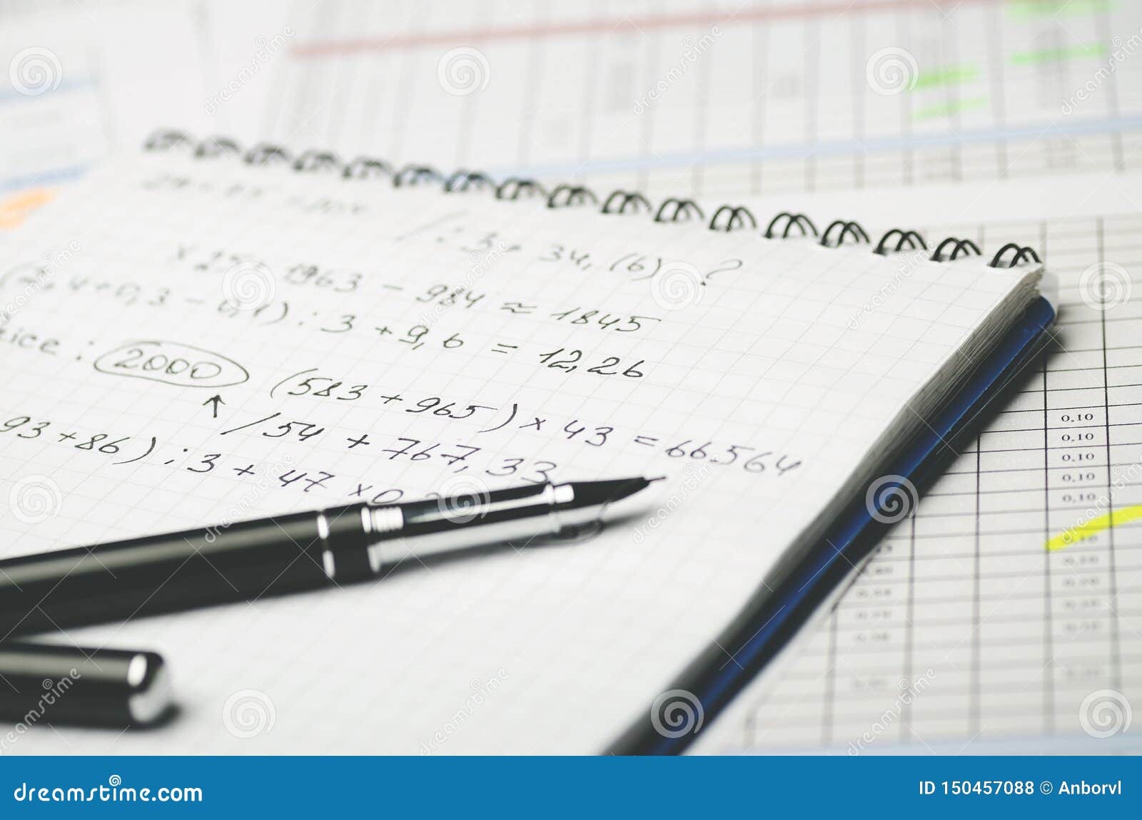 Paper Notebook with Accounting Calculations and Pen on the Background ...