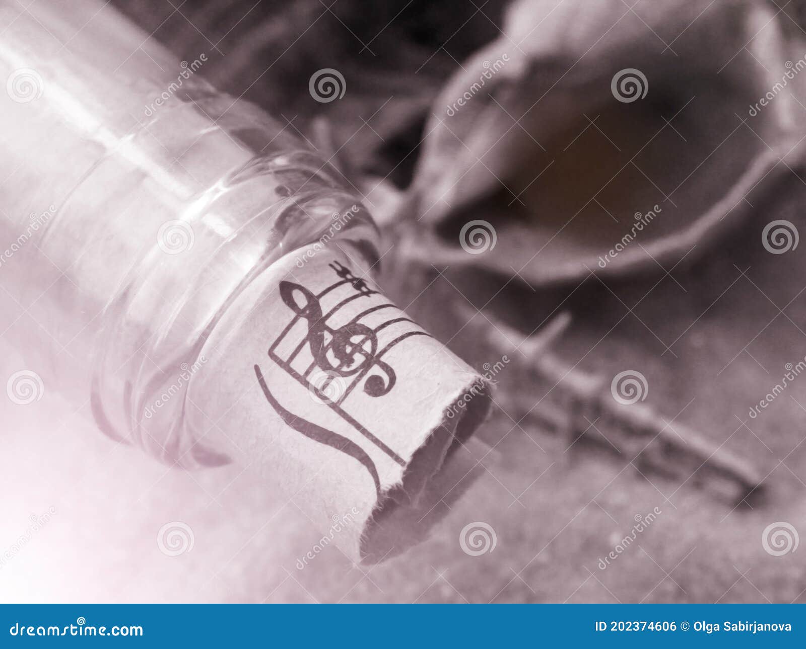Paper Notes Roll in a Bottle on the Sand with Shells Stock Photo ...