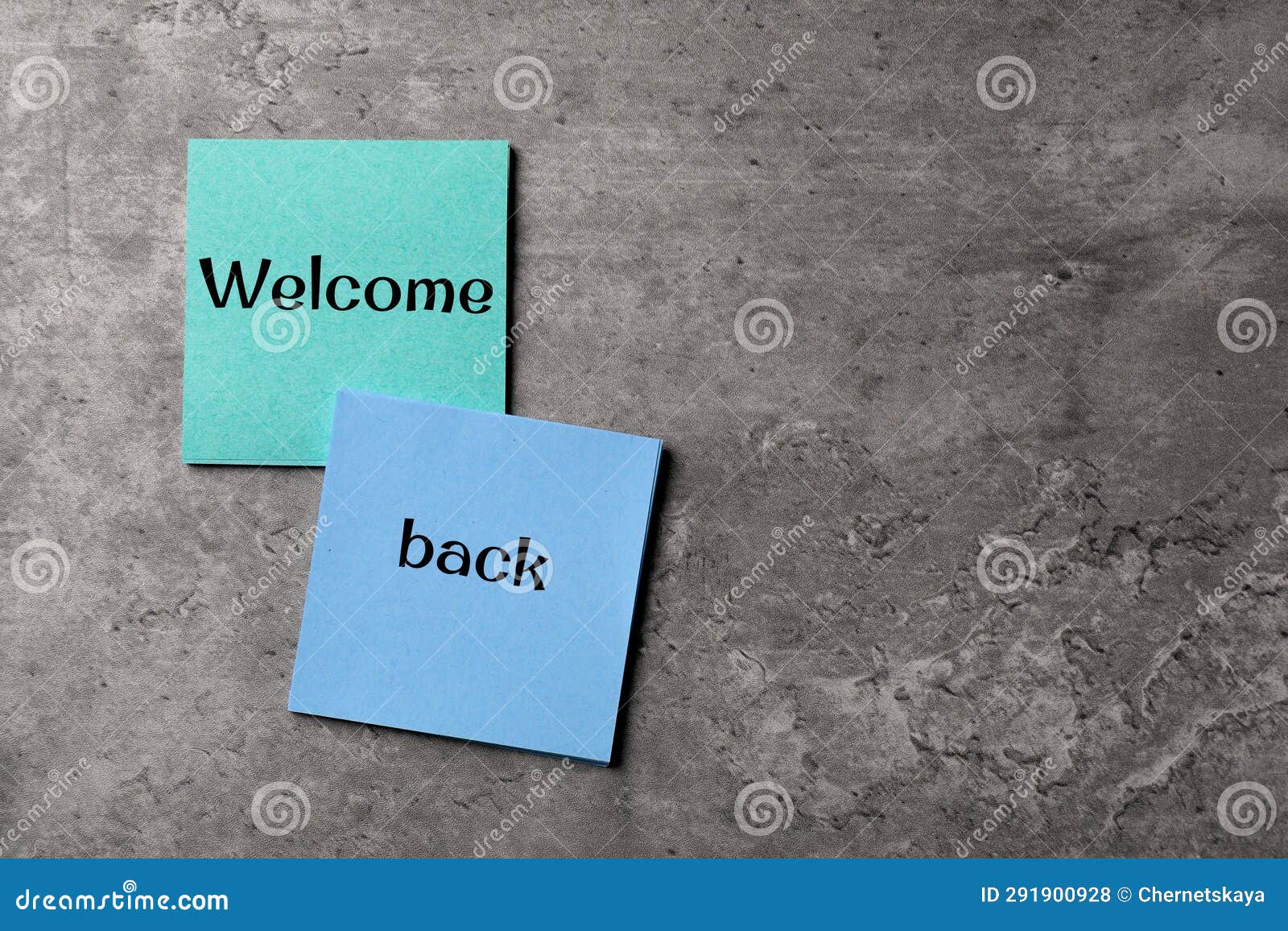Paper Notes with Words Welcome Back on Grey Table, Top View. Space for ...