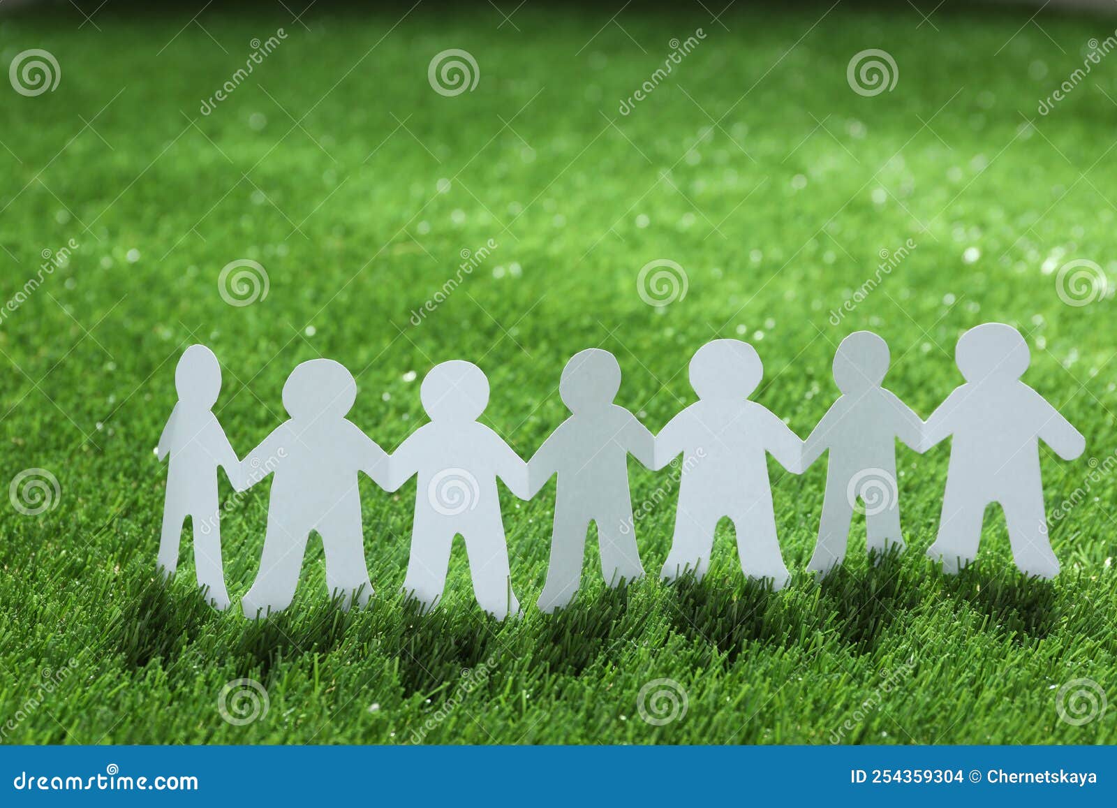 Paper People Chain on Green Grass. Unity Concept Stock Photo - Image of ...