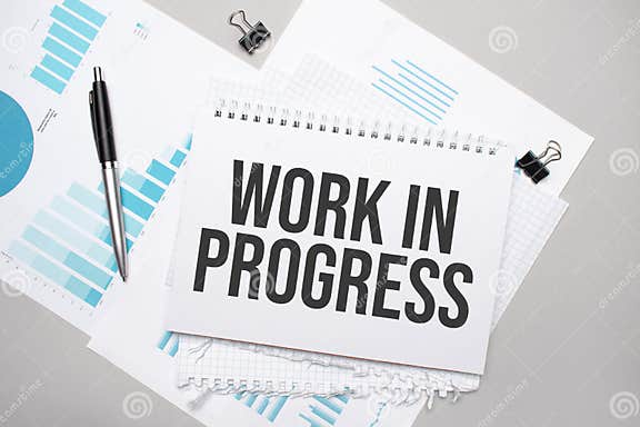 Paper Plate with Text Work in Progress. Diagram, Notepad and Blue ...