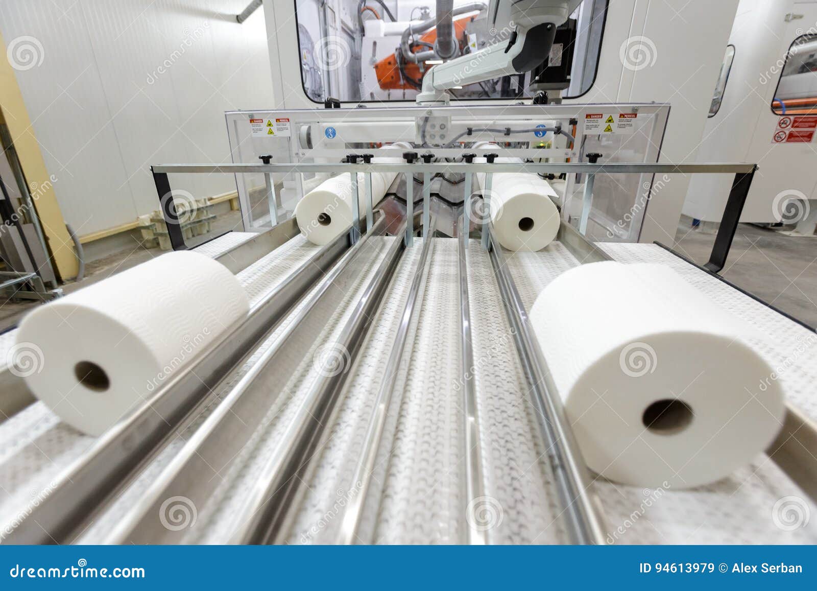 Paper rolls on conveyor stock image. Image of material - 94613979