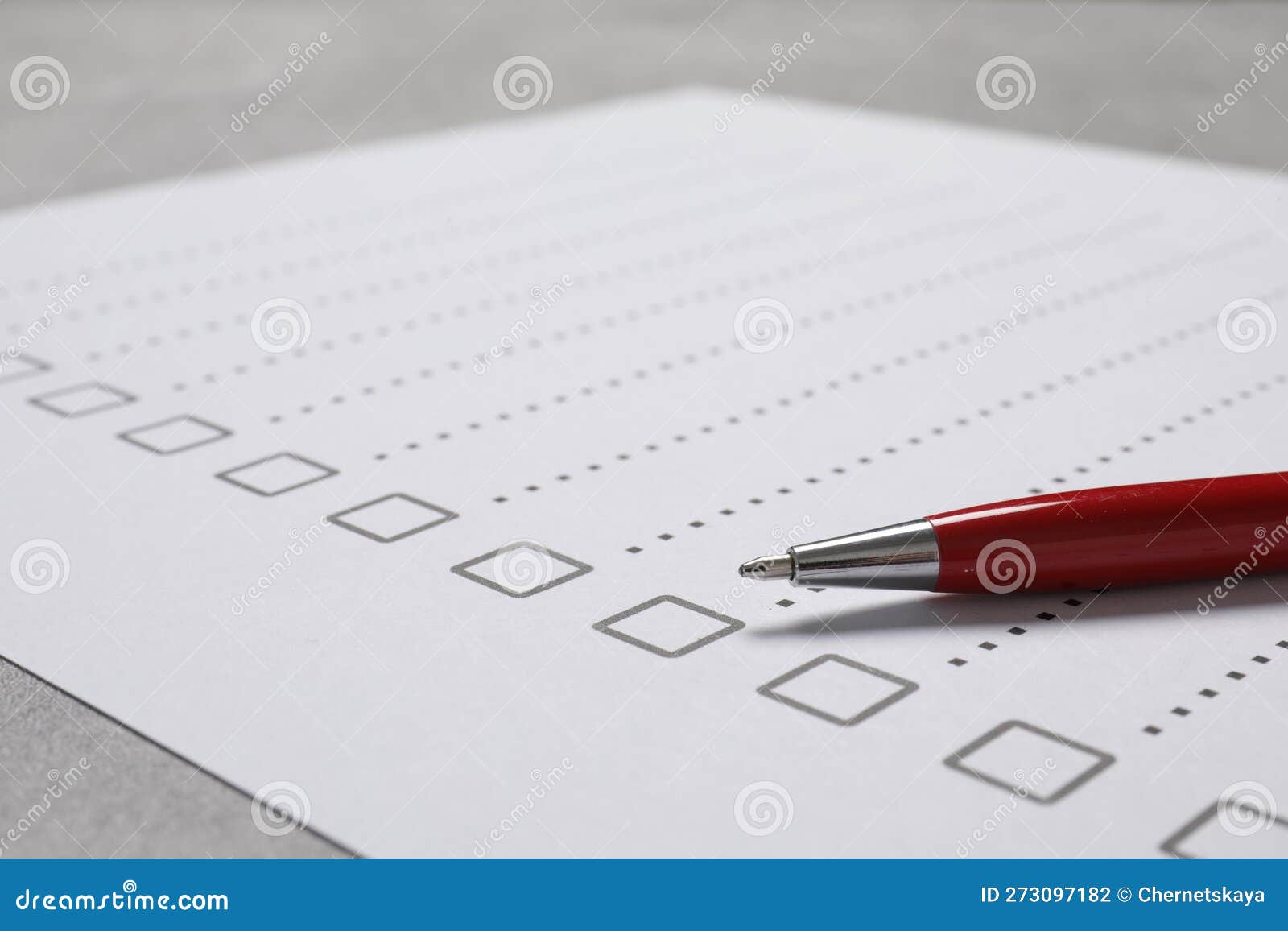 Paper Sheet with Checkboxes and Pen on Light Grey Table, Closeup ...