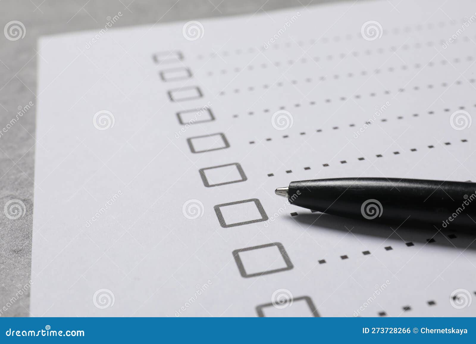 Paper Sheet with Checkboxes and Pen on Light Grey Table, Closeup ...