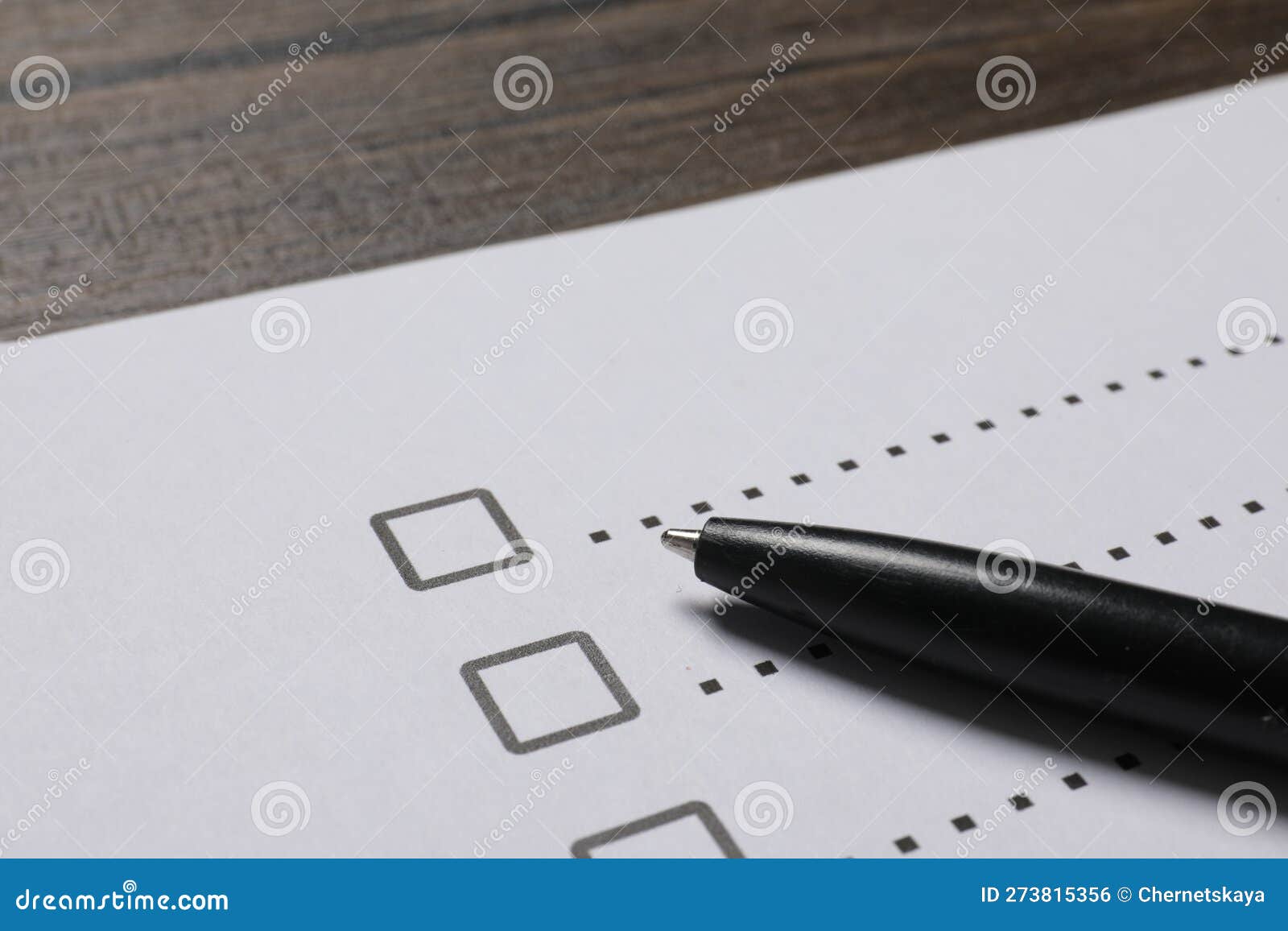 Paper Sheet with Checkboxes and Pen on Wooden Table, Closeup. Checklist ...