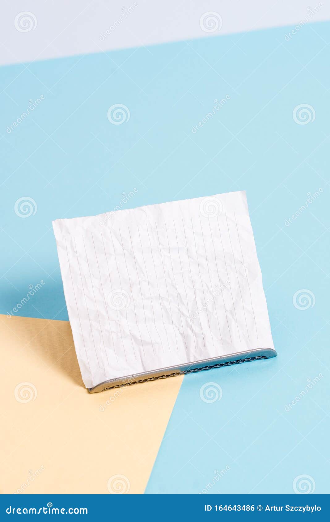 Paper Sheet Placed Tilted on a Buffer Wire with a Soft Pastel Backdrop ...