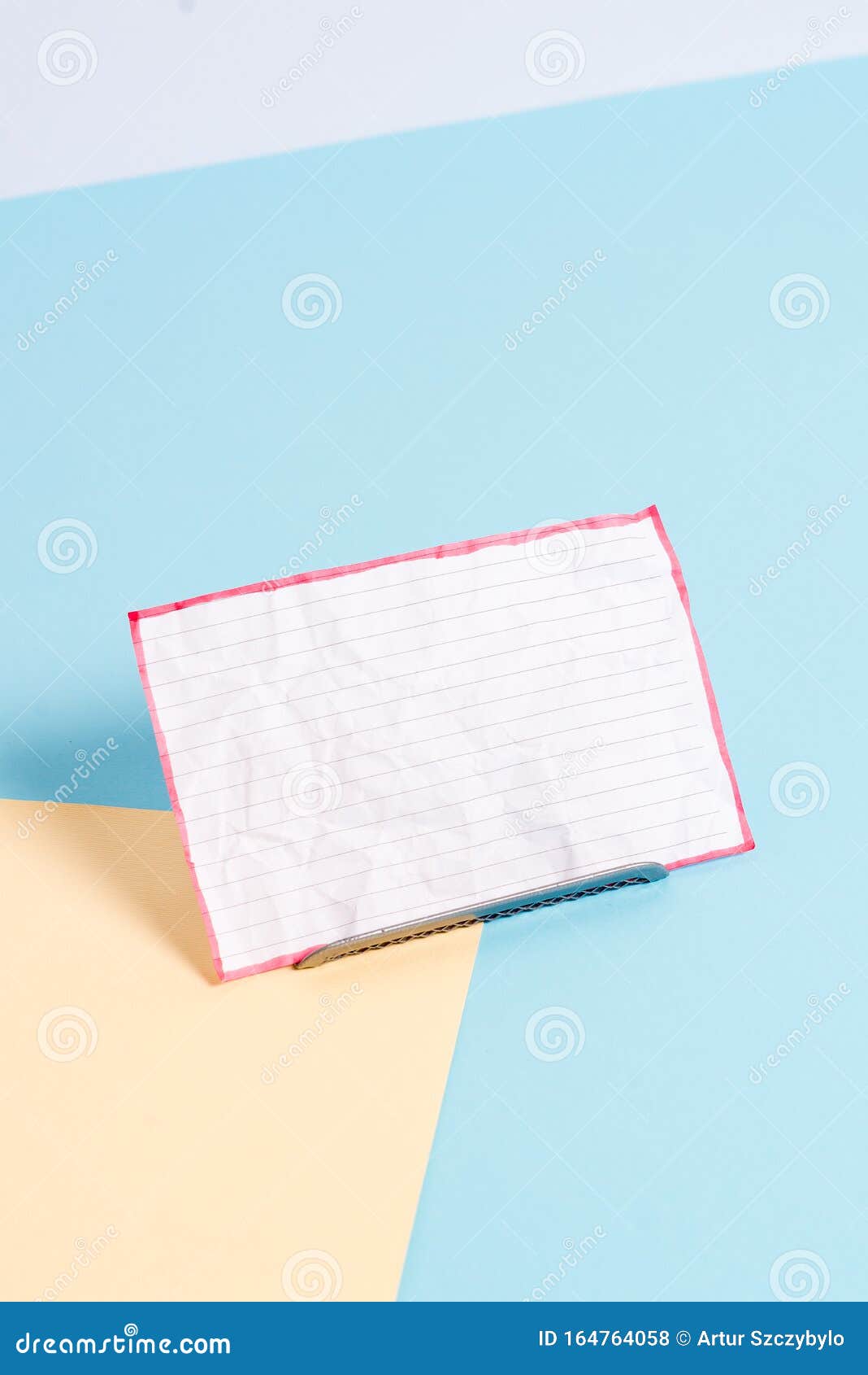 Paper Sheet Placed Tilted on a Buffer Wire with a Soft Pastel Backdrop ...