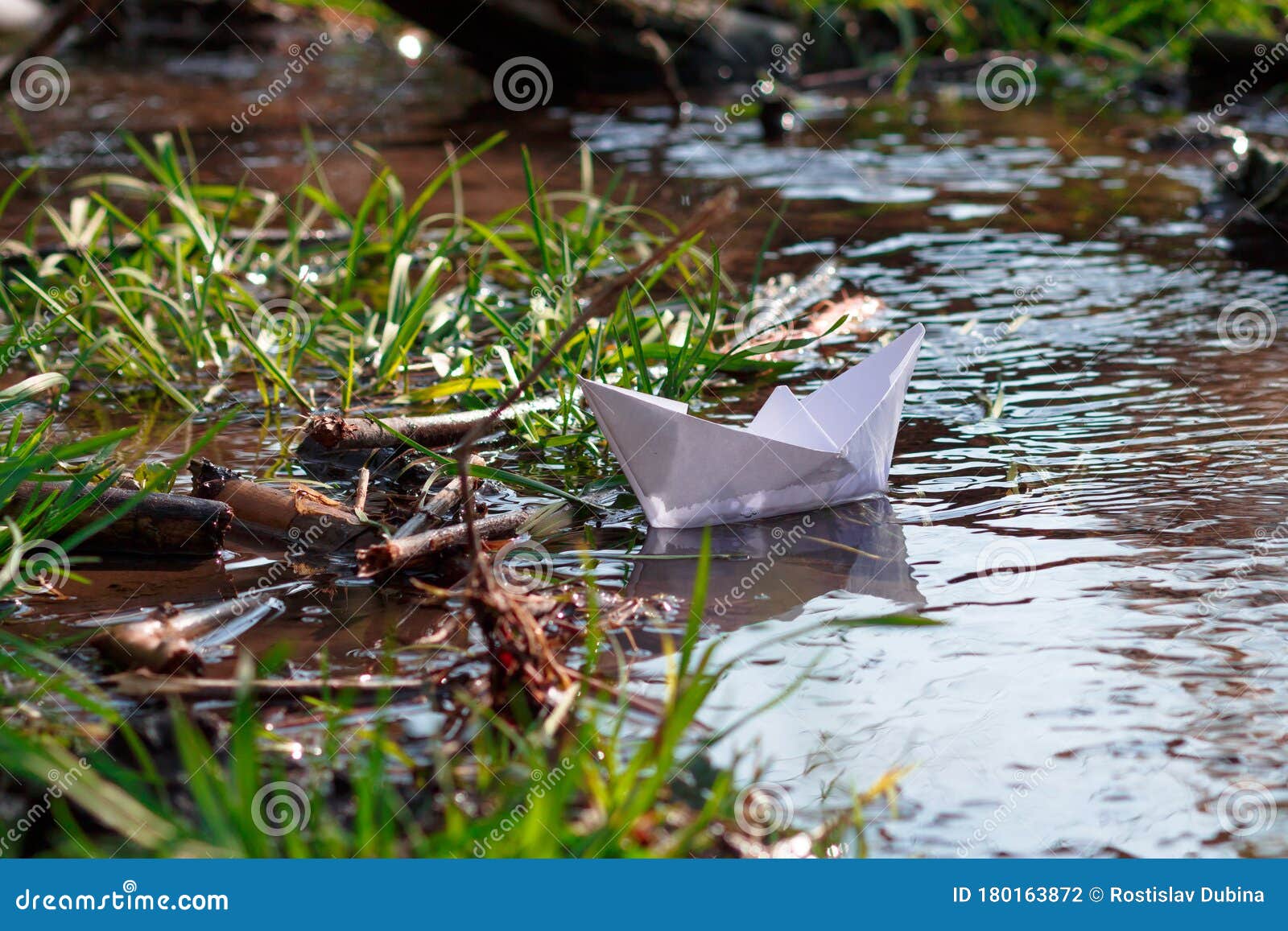 Paper Ship. a Paper Boat is Floating on the Water. White Paper Ship. a ...