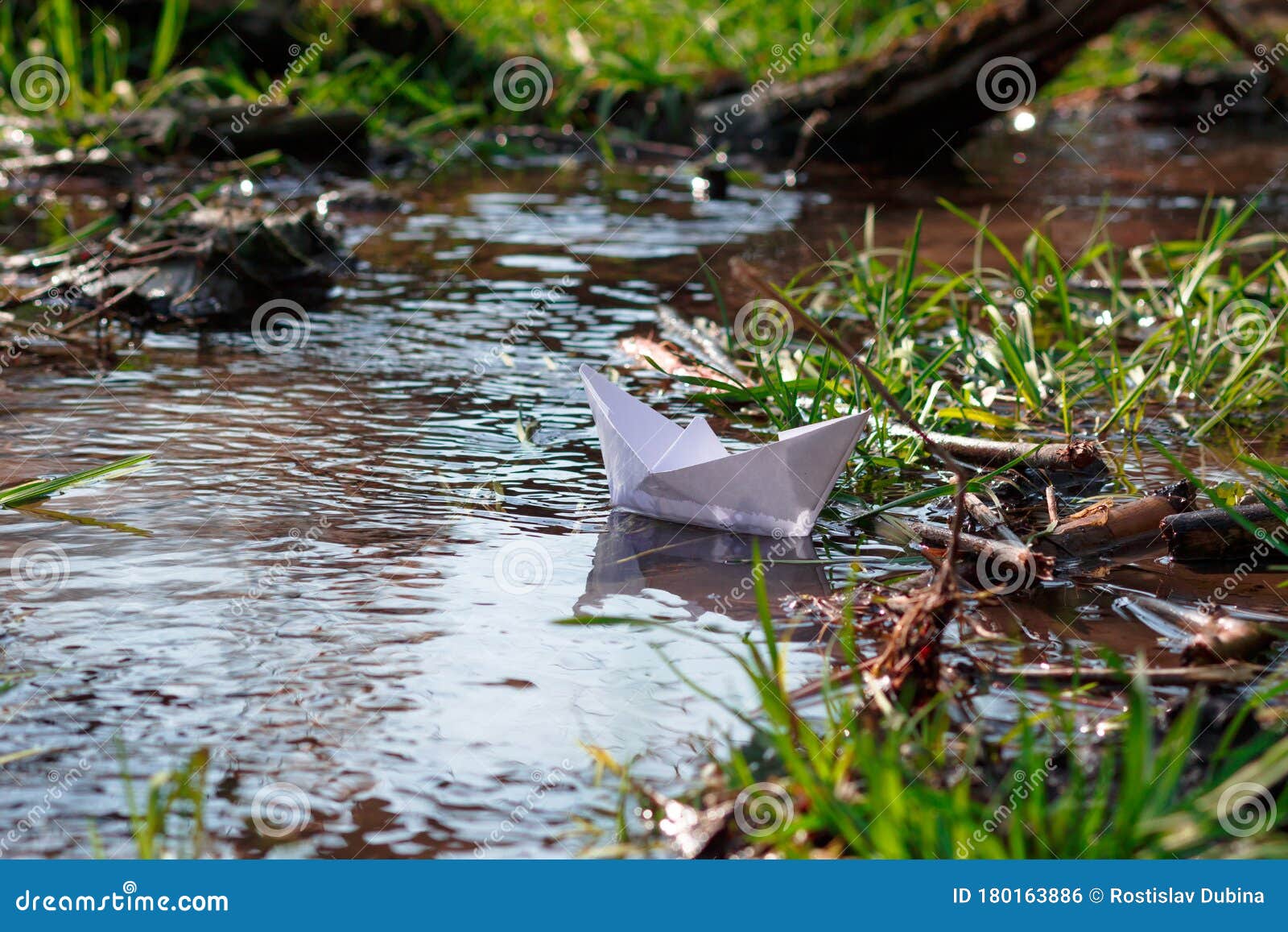Paper Ship. a Paper Boat is Floating on the Water. White Paper Ship. a ...