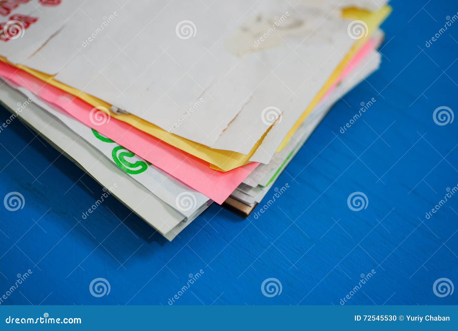 Paper stack on blue desk stock photo. Image of organization - 72545530