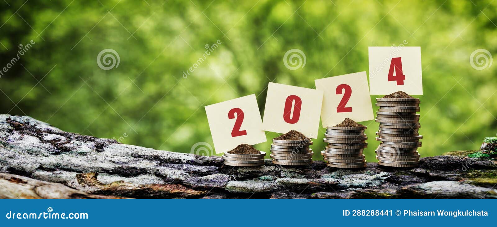 The Paper is on a Stack of Coins and Has the Text 2024 Stock Image ...