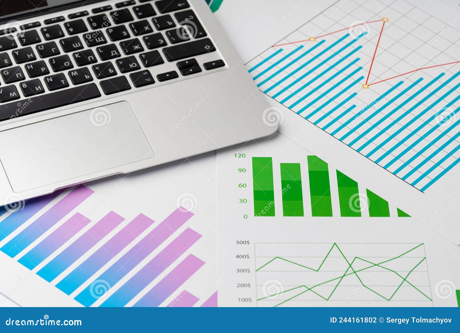 Paper Statistics Charts and Laptop Keyboard on White Table Stock Photo ...