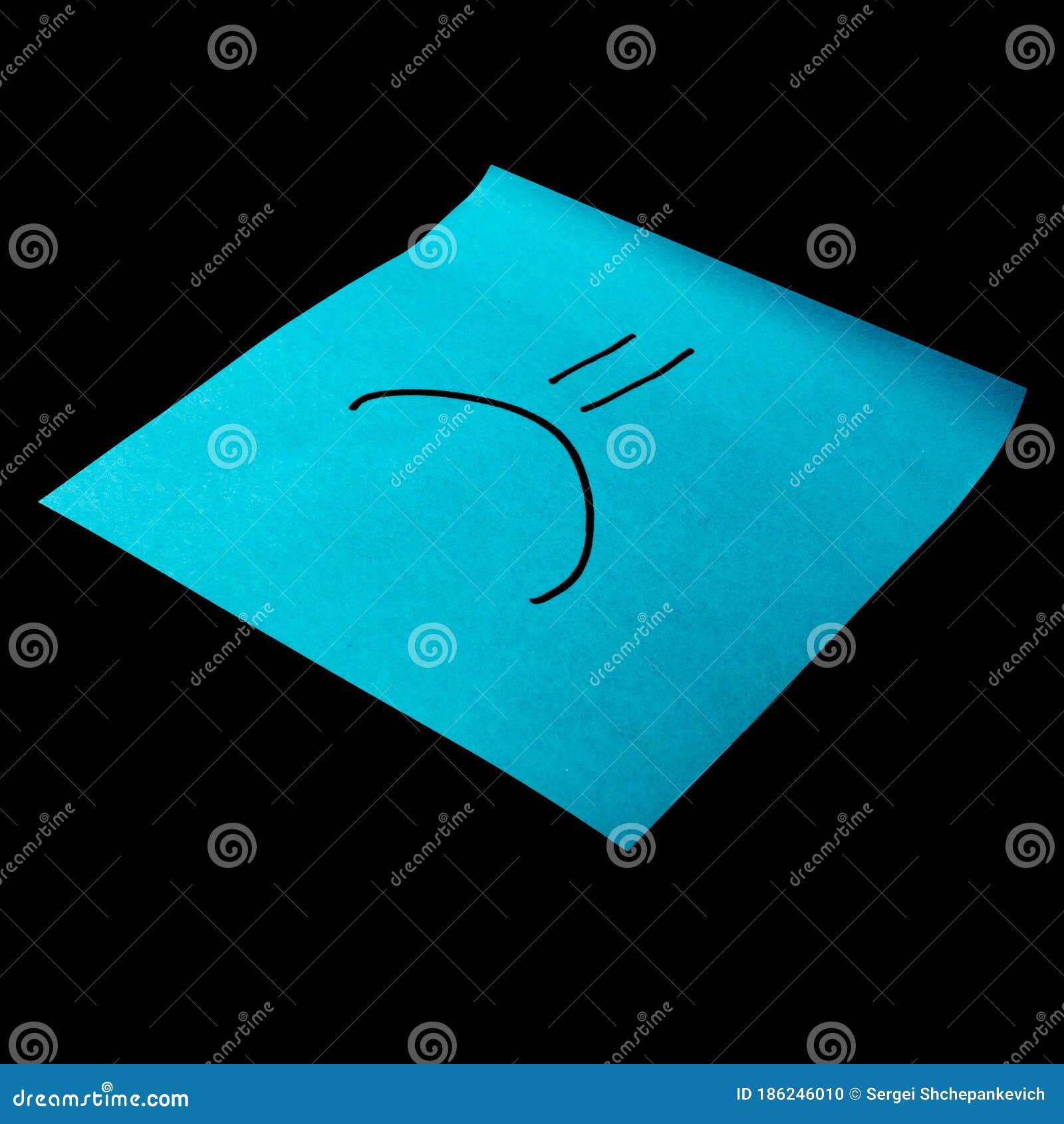 Paper Sticker with the Image of the Symbol of a Sad Emoticon on Dark ...