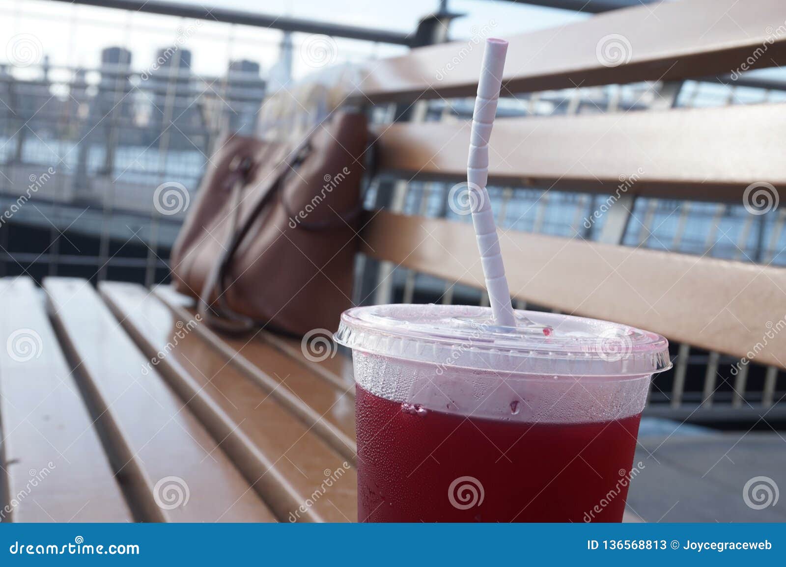 Paper Straw in a Take-out Plastic Cup, on a Bench Stock Image - Image ...