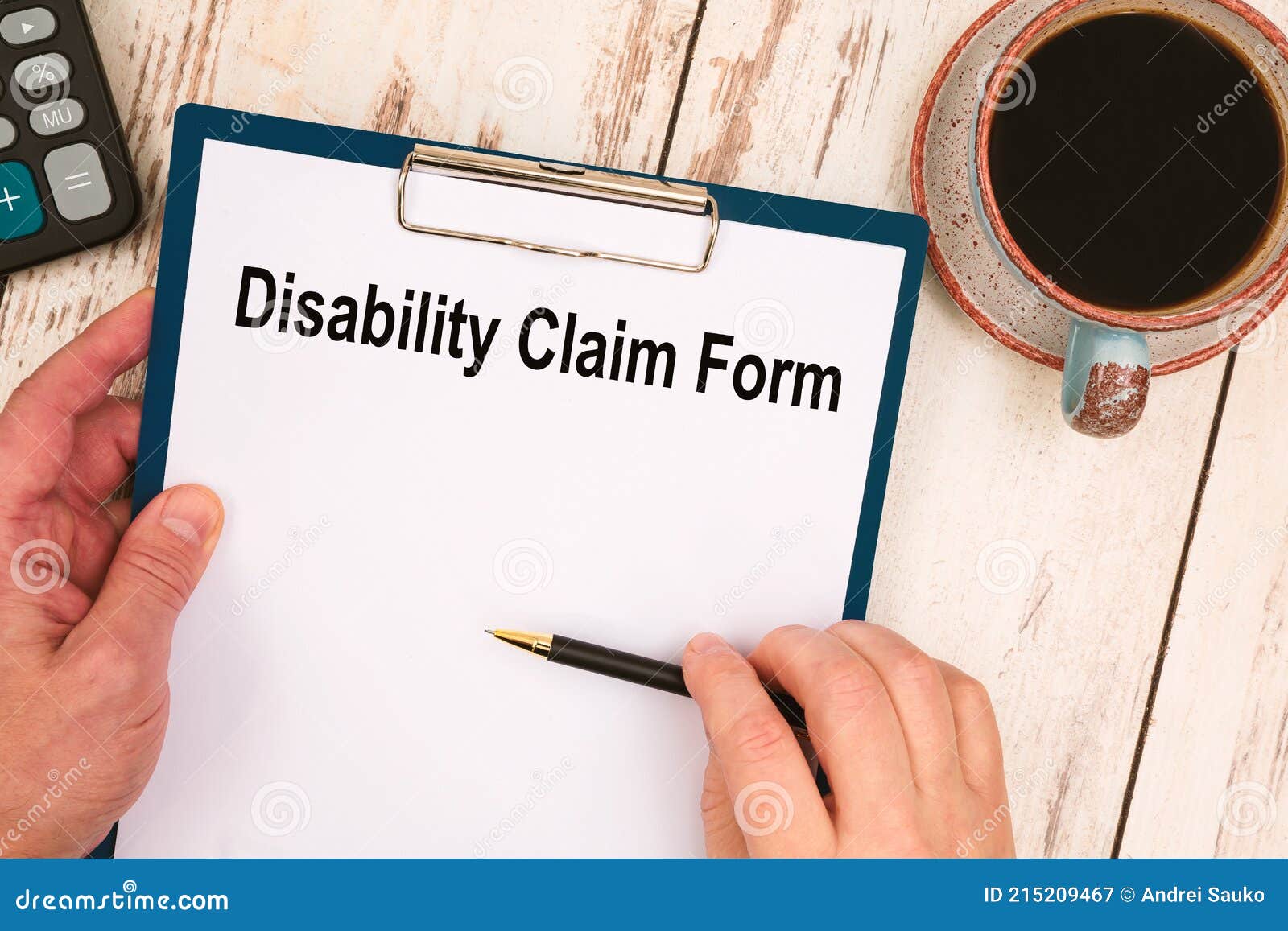 Paper with Text - DISABILITY CLAIM FORM on the Table, Calculator and ...