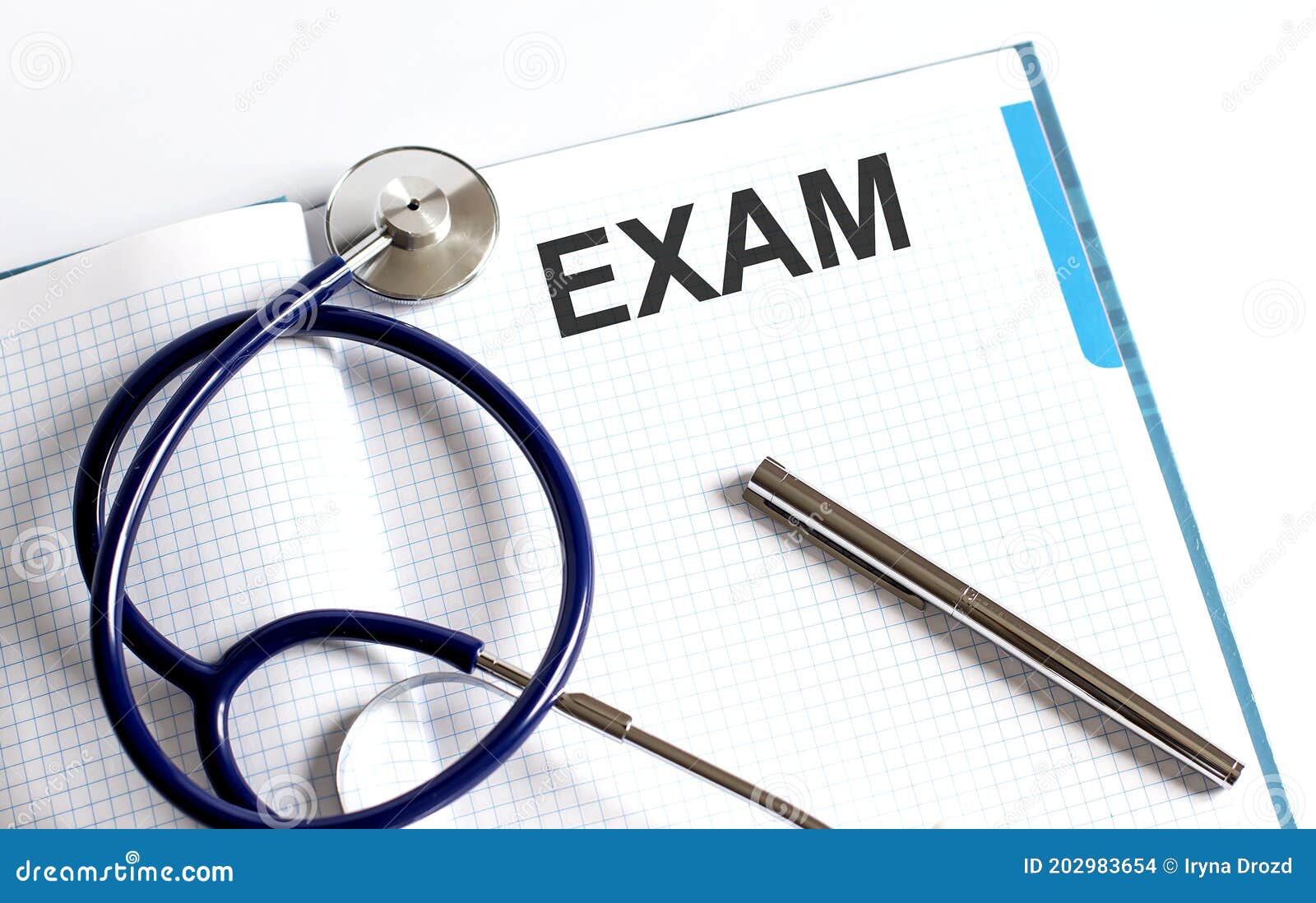 Paper with Text EXAM on a Table with Stethoscope Stock Photo - Image of ...