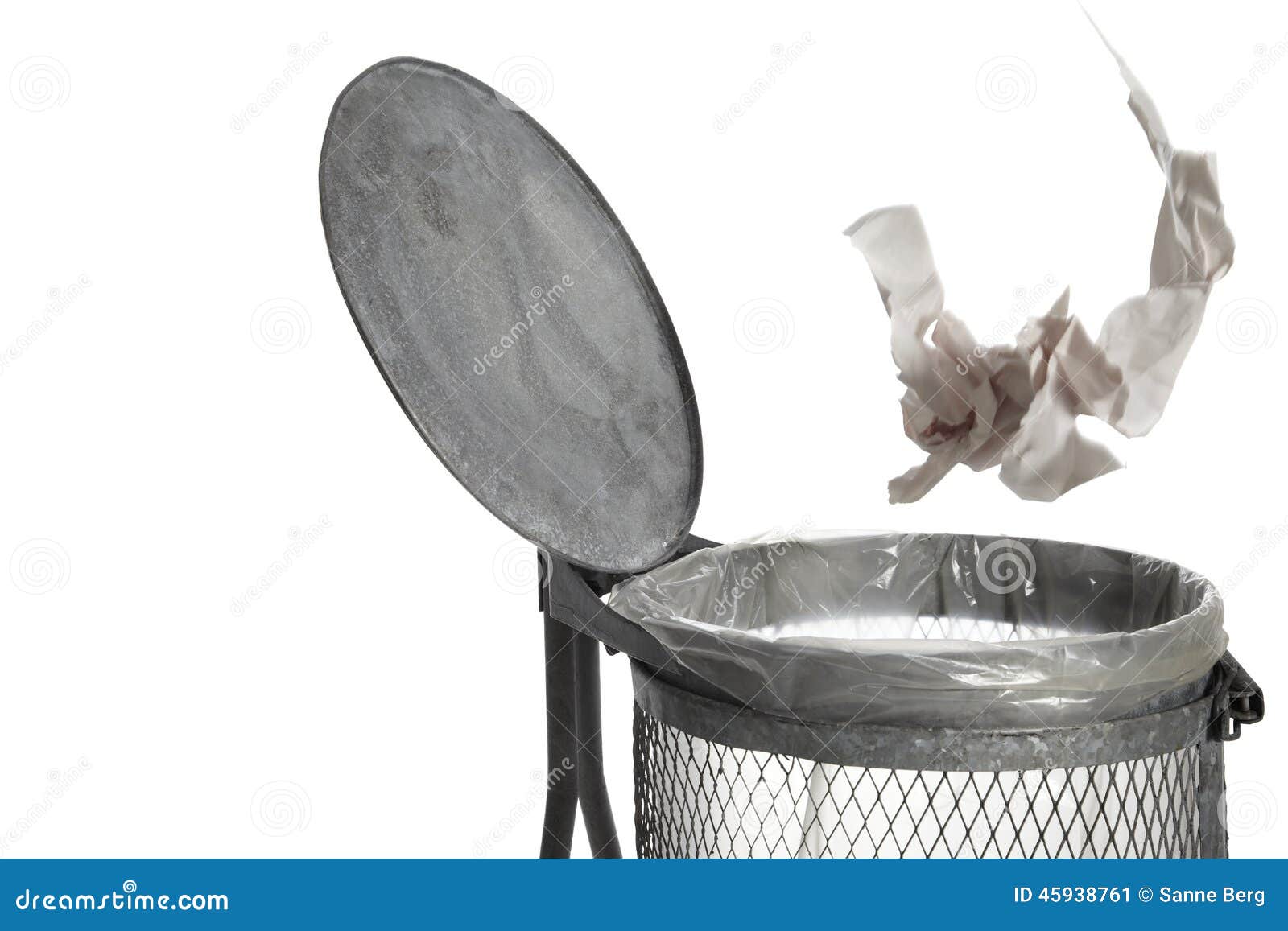 Paper Tossed into Trash Bin on White Background Stock Image - Image of ...