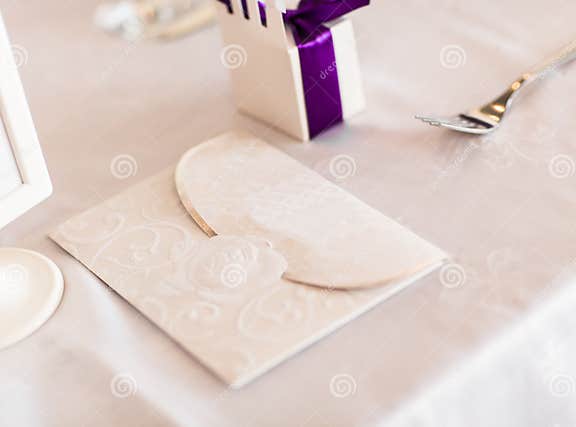 Paper Wedding Invitation on the Table Stock Photo - Image of invitation ...