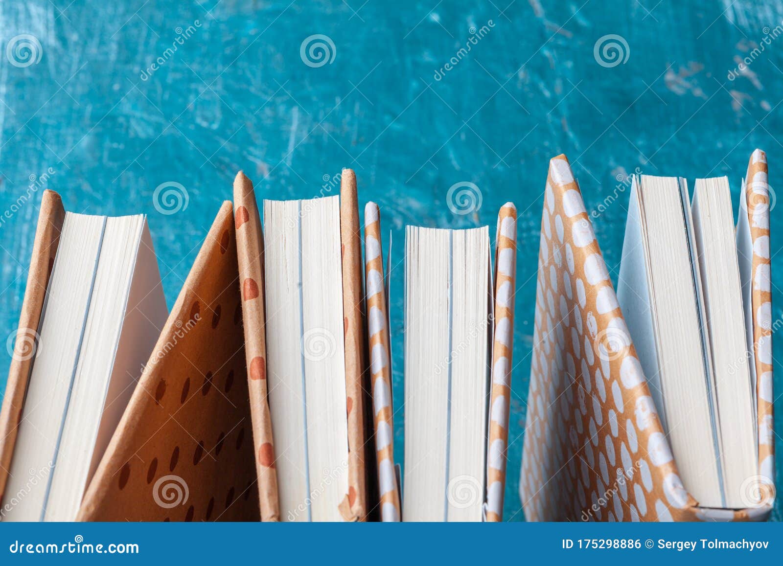 Paperback Books on a Table Creative Photo. Stock Photo - Image of ...