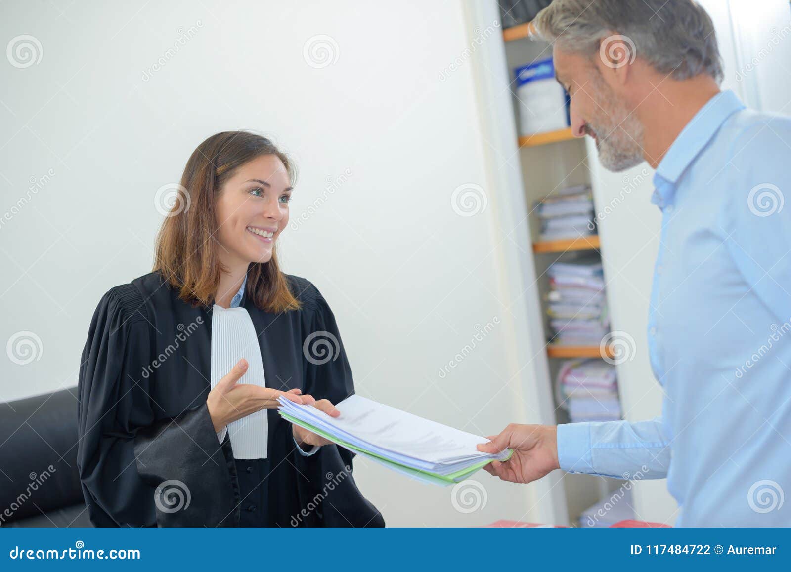 Paperwork Being Passed between Lawyer and Client Stock Photo - Image of ...