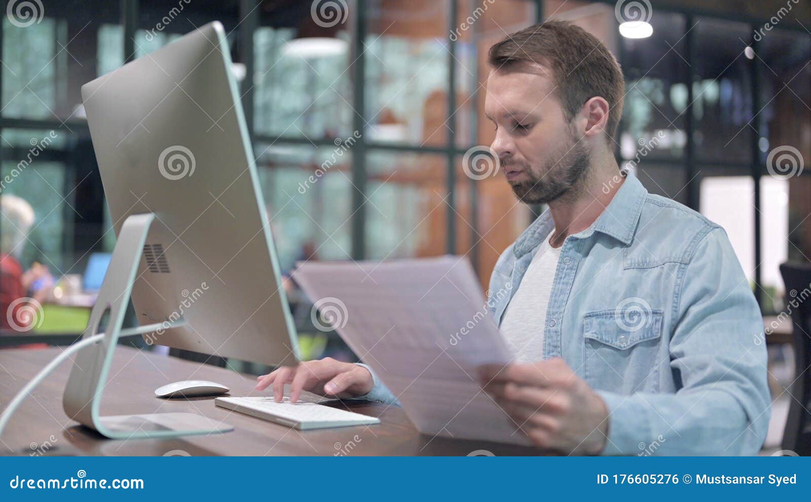 Paperwork by Creative Young Man Using Computer Stock Photo - Image of ...