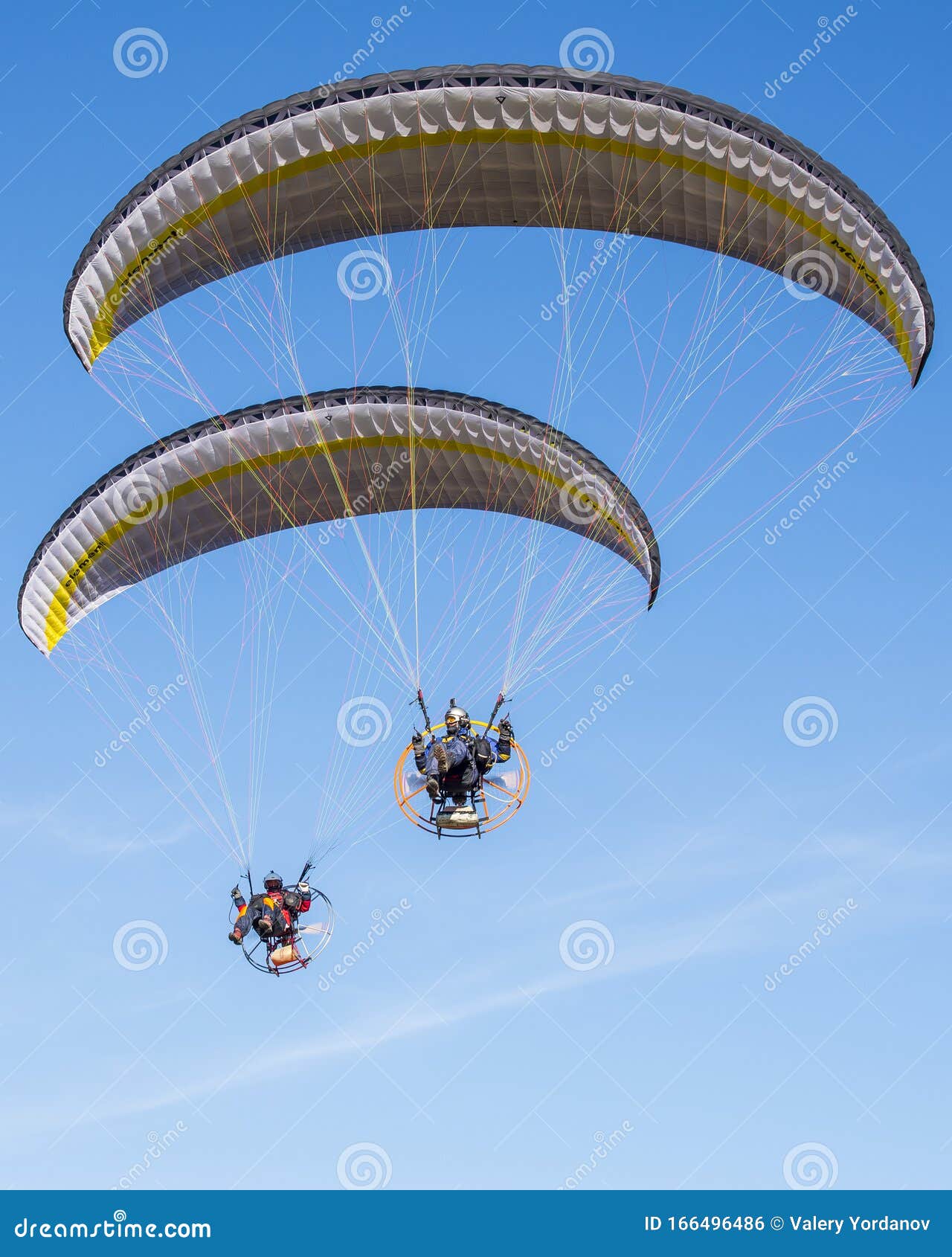 Para Gliders with Engine Flying in the High Blue Sky Stock Photo ...