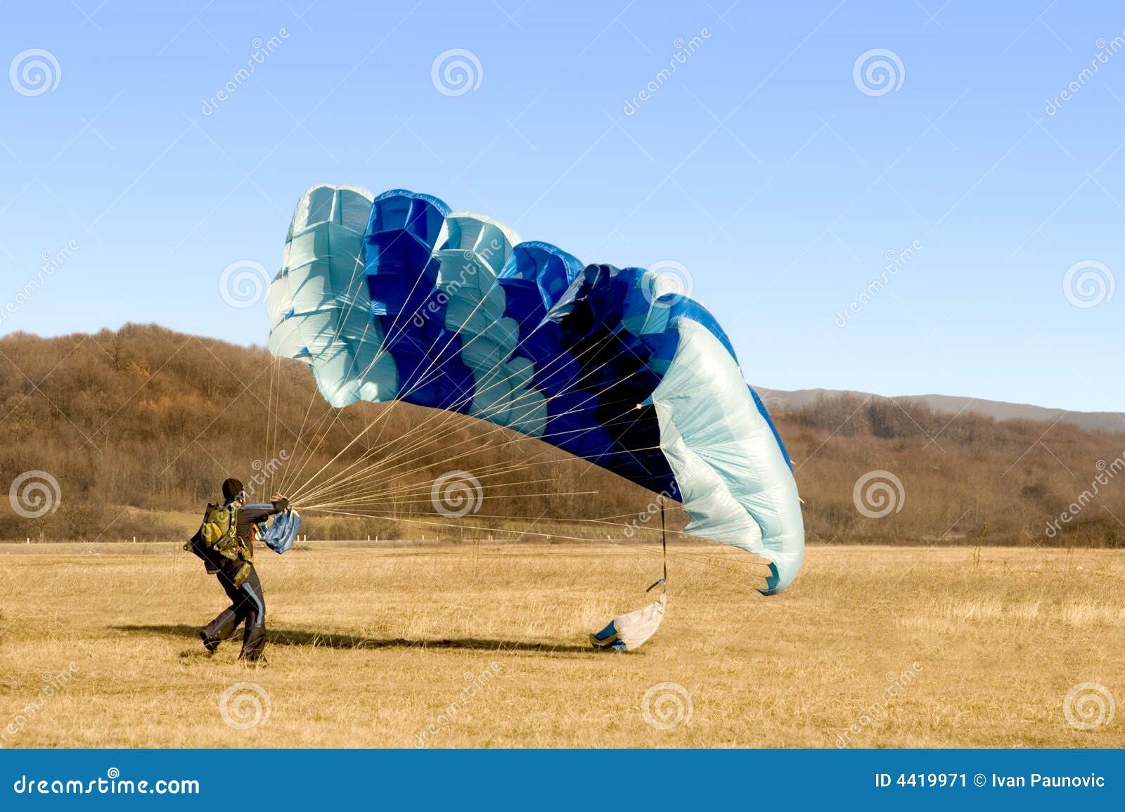 Parachute landed stock image. Image of adventure, paraglider - 4419971