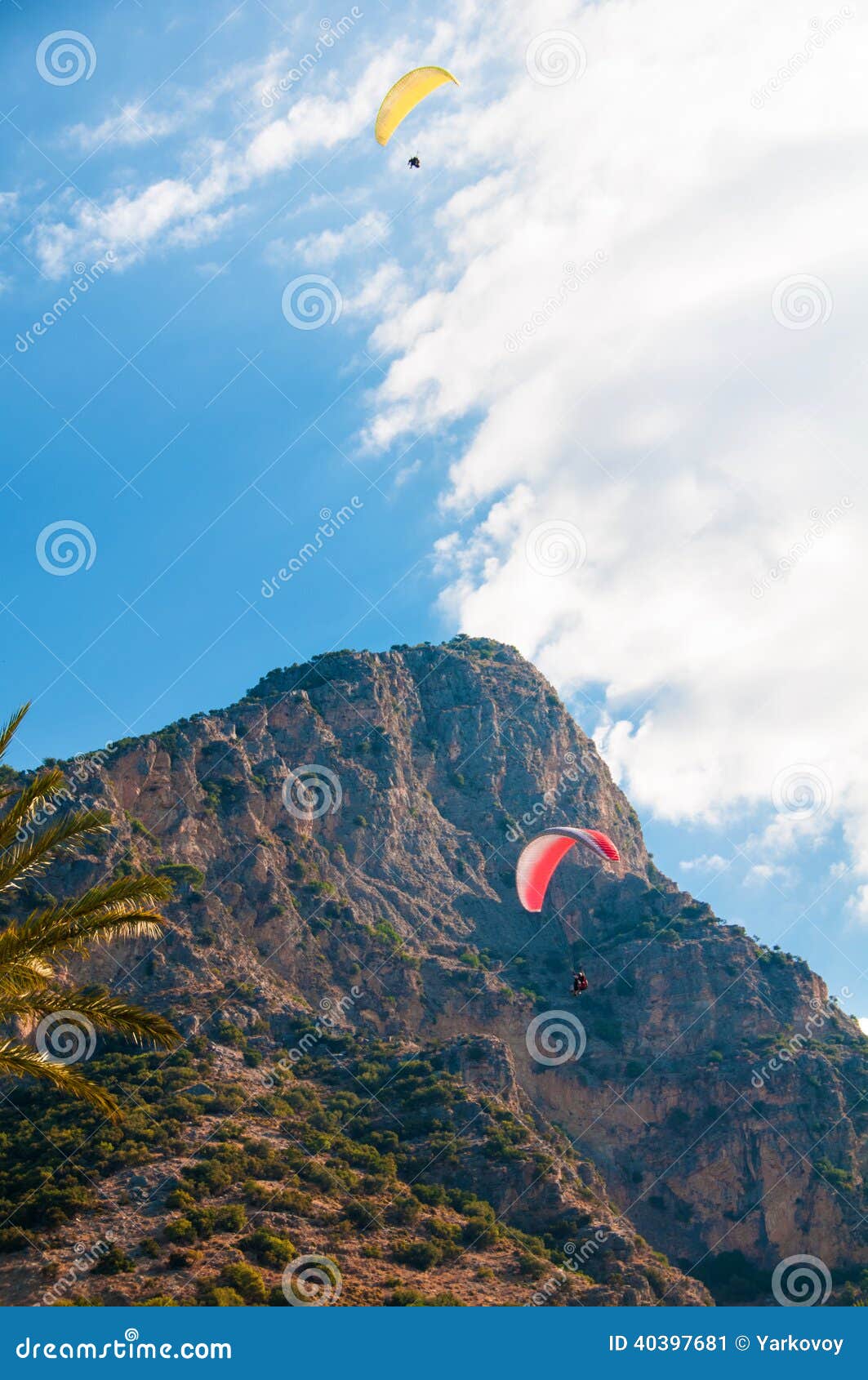 Parachute Soaring In The Clouds On A Background Of Sky And Mountains ...