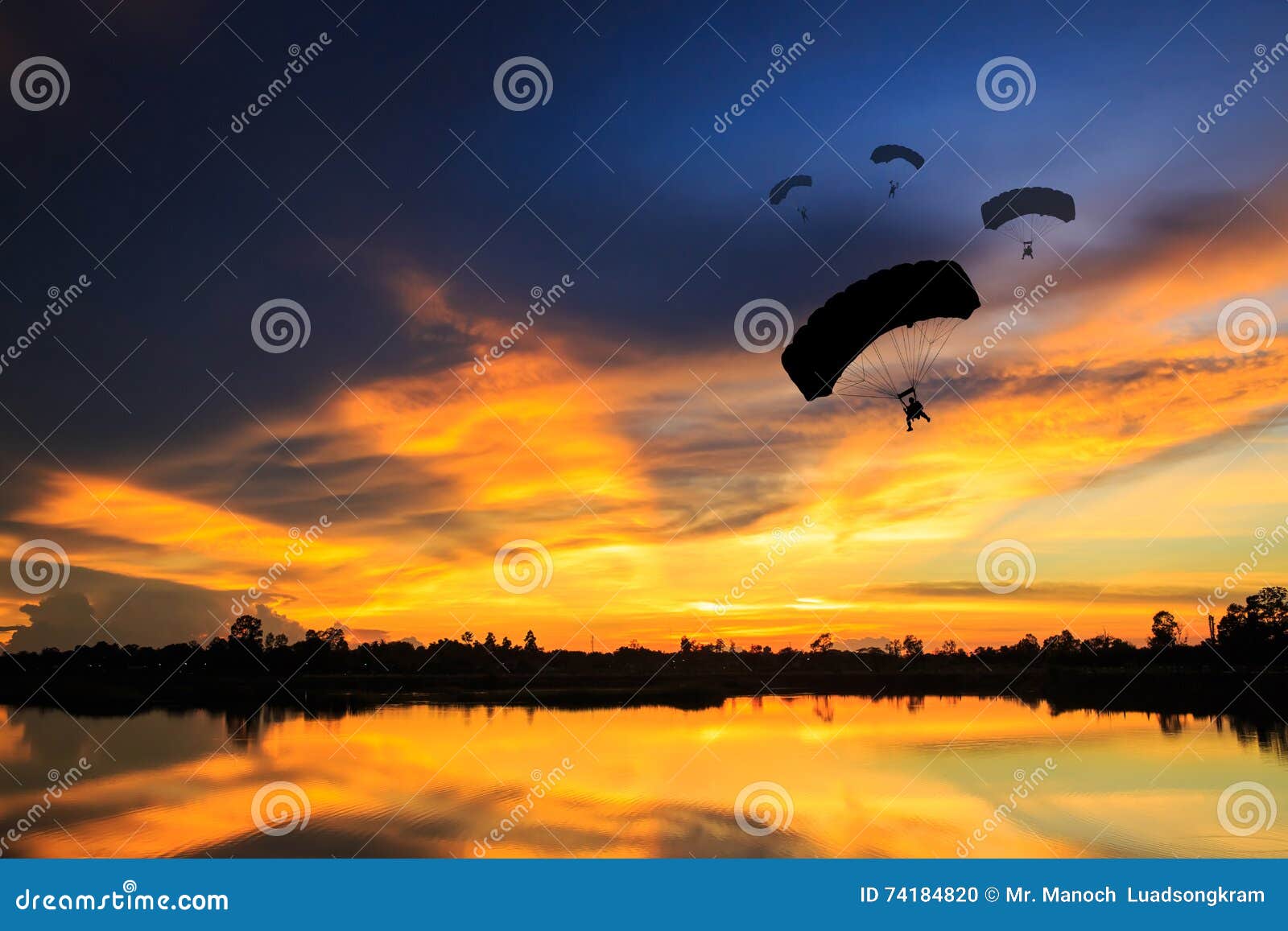 Parachute at sunset stock photo. Image of cloud, extreme - 74184820