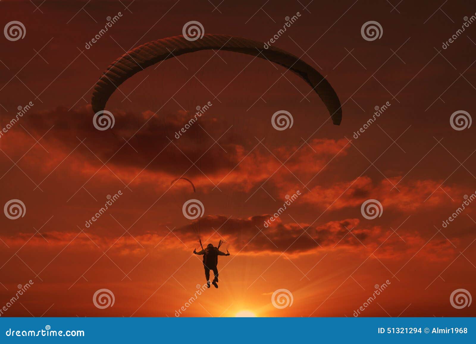 Parachute in the sunset. stock photo. Image of flight - 51321294