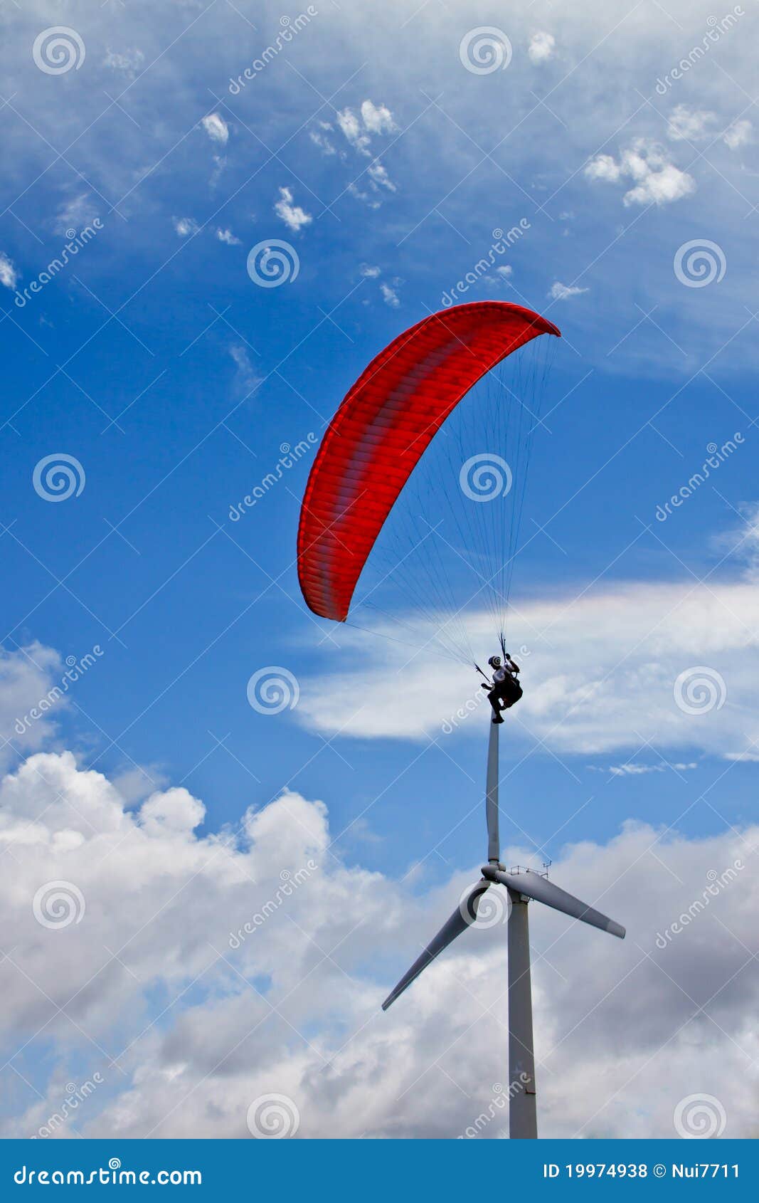 Parachuter with Wind Generator Stock Photo - Image of green, alone ...