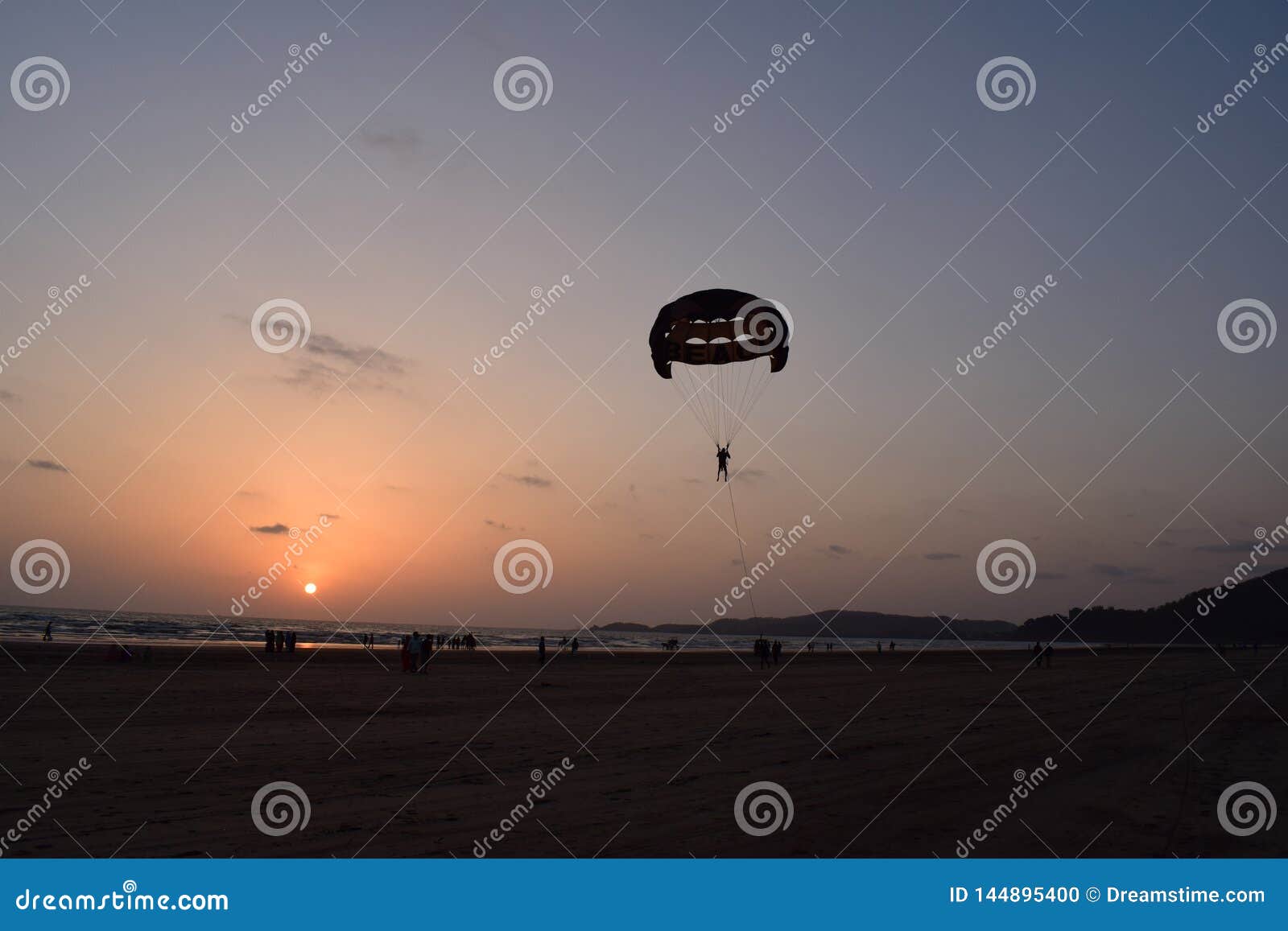 Parachuting on beach stock photo. Image of summer, thrilling - 144895400