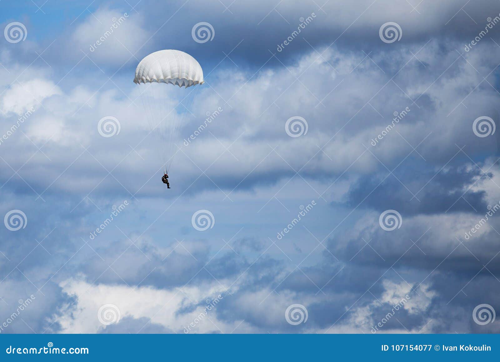 Parachutist Descending from Above with a White Canopy Stock Image ...