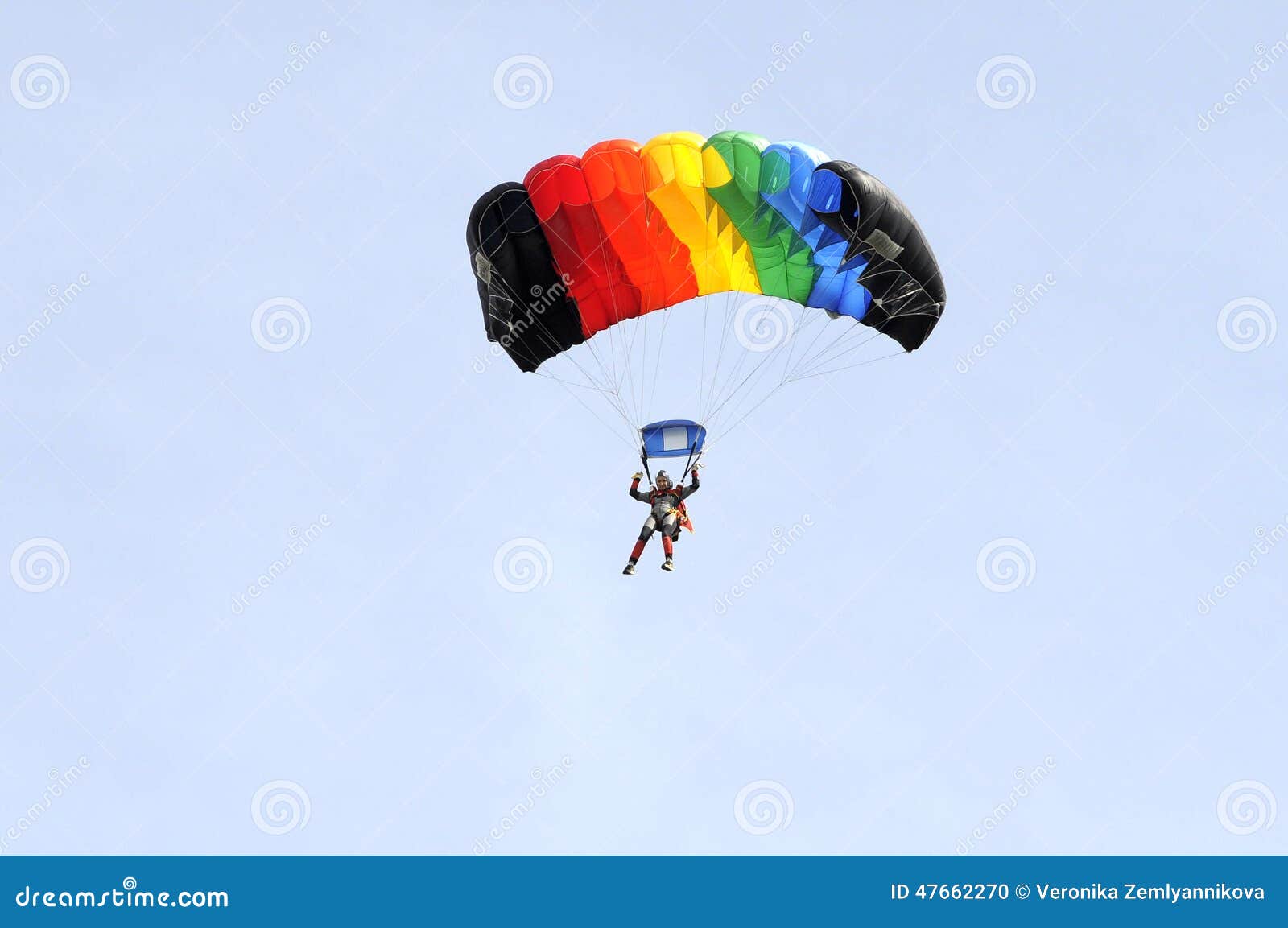 The Parachutist Goes Down on a Multi-colored Parachute. Editorial Image ...