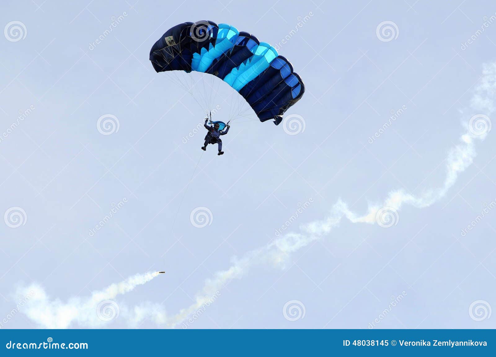 The Parachutist Goes Down on a Multi-colored Parachute. Editorial Image ...