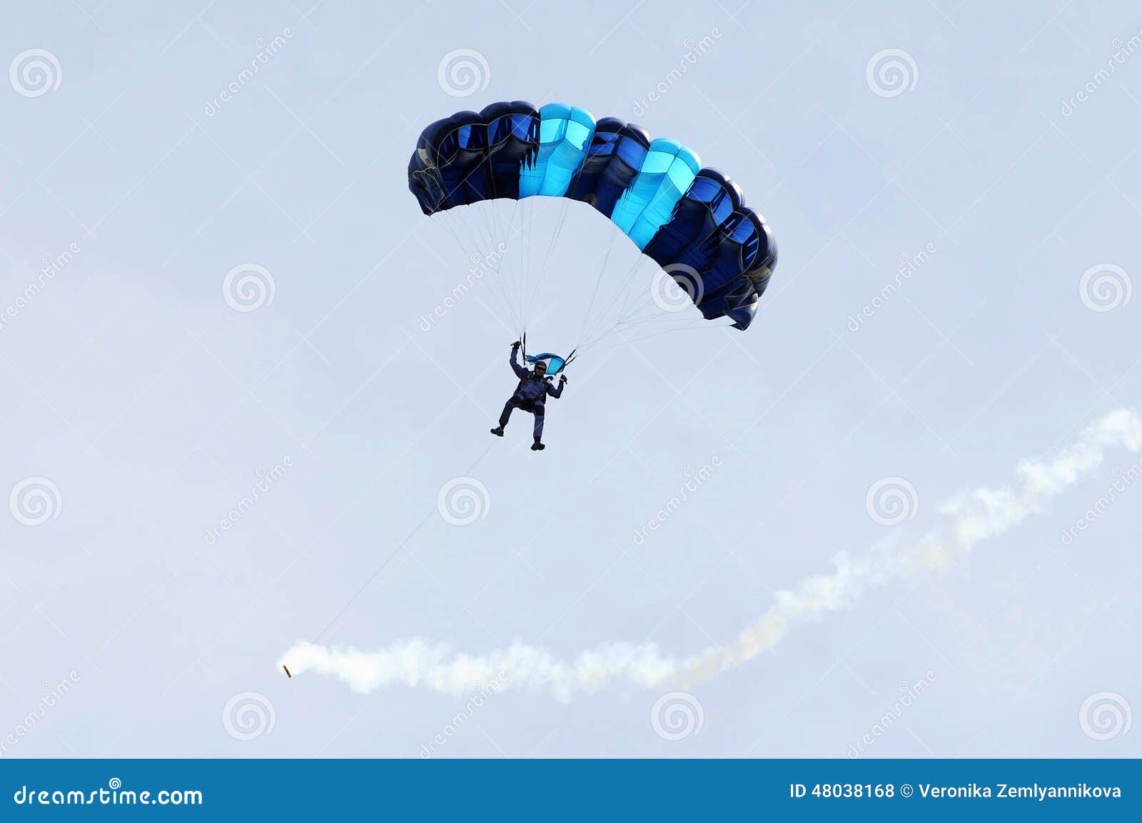 The Parachutist Goes Down on a Multi-colored Parachute. Editorial Stock ...