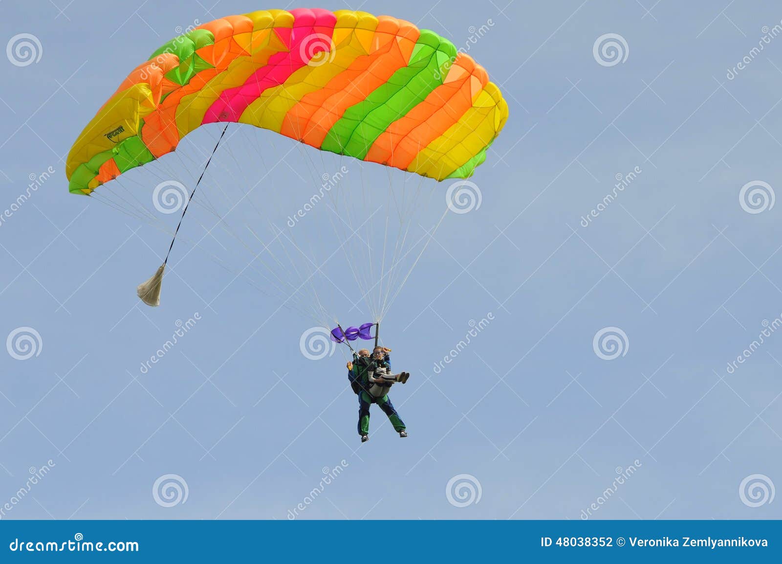 The Parachutist Goes Down on a Multi-colored Parachute. Editorial ...