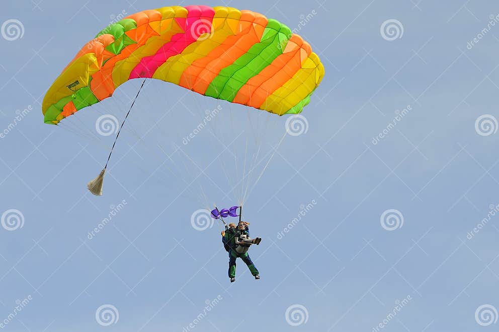 The Parachutist Goes Down on a Multi-colored Parachute. Editorial ...
