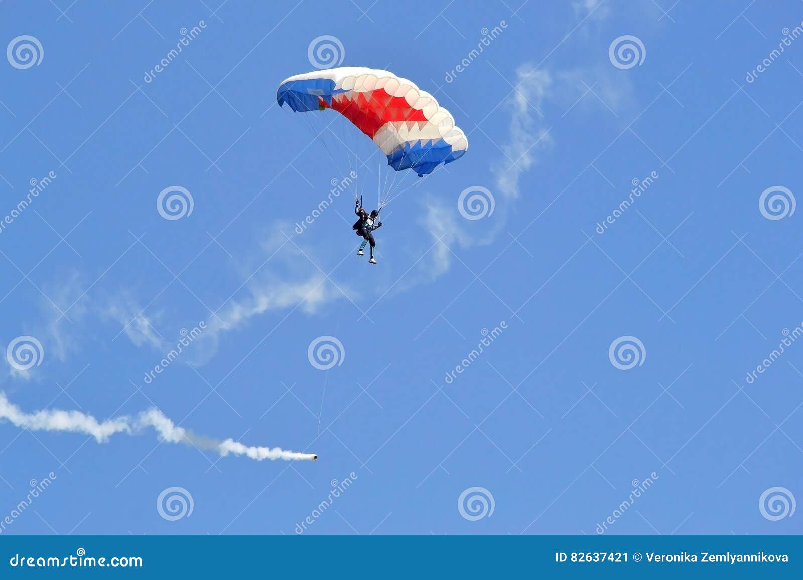 The Parachutist with a Multi-colored Parachute Flies in the Sky ...